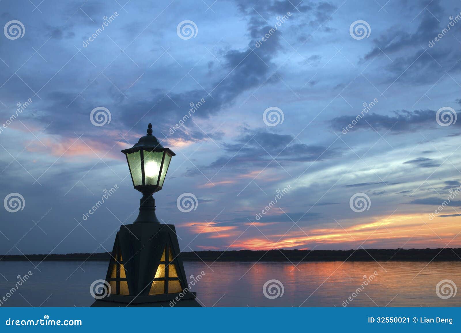Lamp Lights Up by the River Stock Image - Image of clear, blue: 32550021