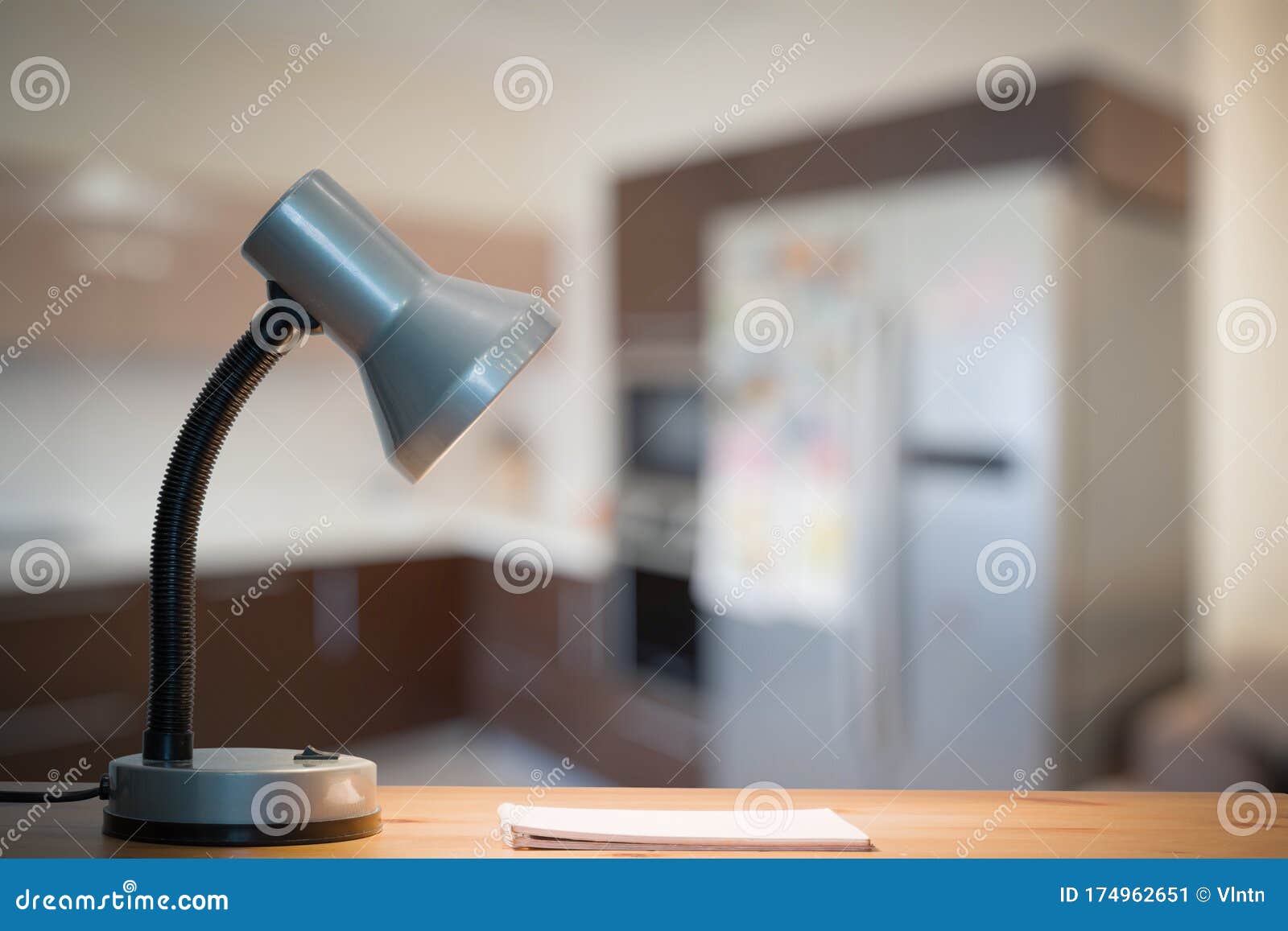 Lamp and notebook on table stock image. Image of interior - 174962651