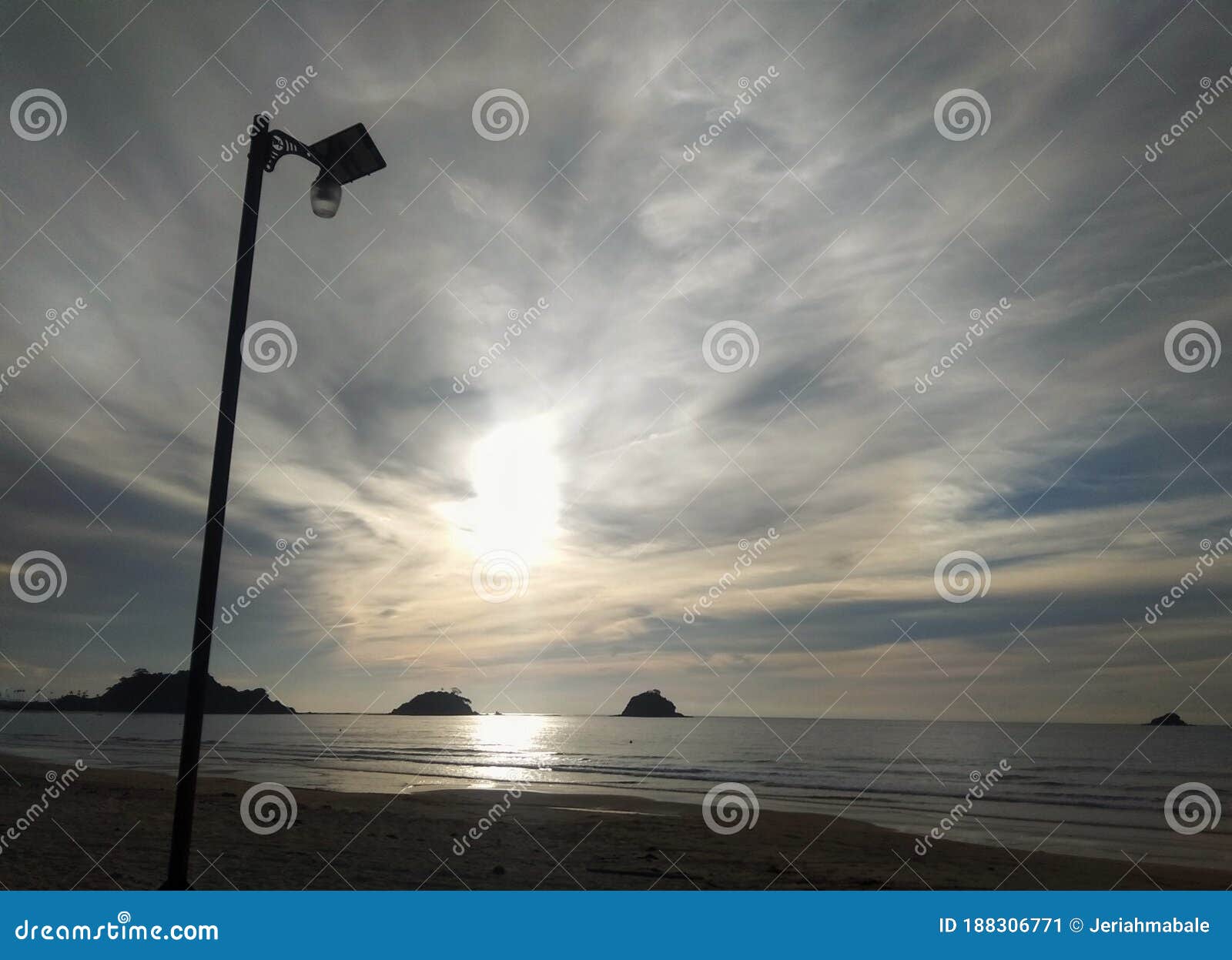 A lamp post on a beach. stock image. Image of sunlight - 188306771