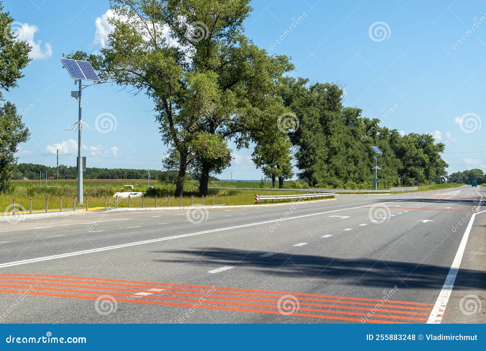 Lamp Post with Solar Panel System on Road with Blue Sky and Trees ...