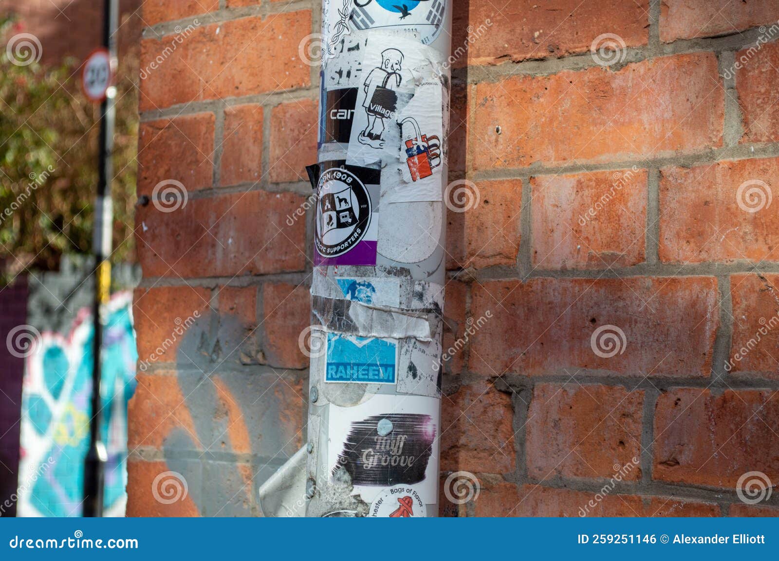 Lamp Post with Various Stickers and Tags on it Editorial Photo - Image ...