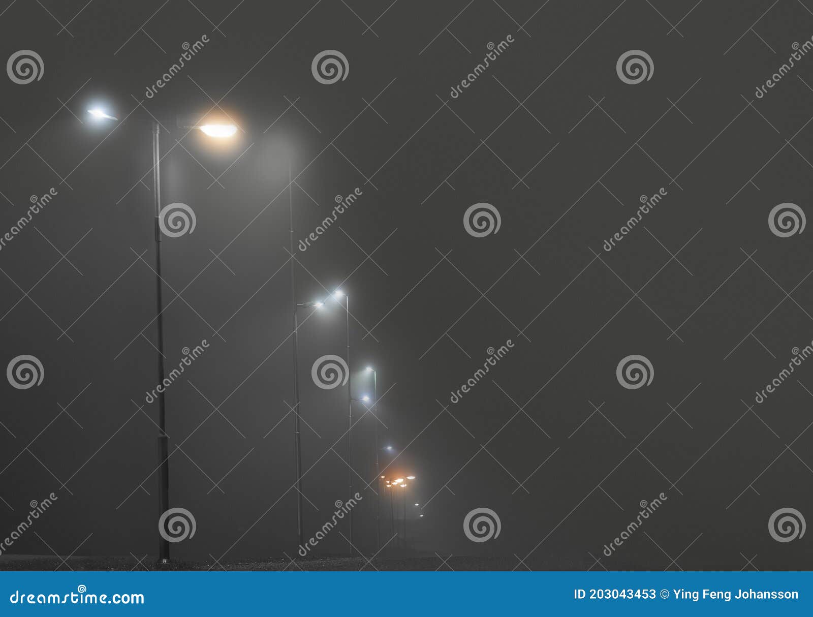 Lamp posts in heavy fog stock image. Image of mystery - 203043453