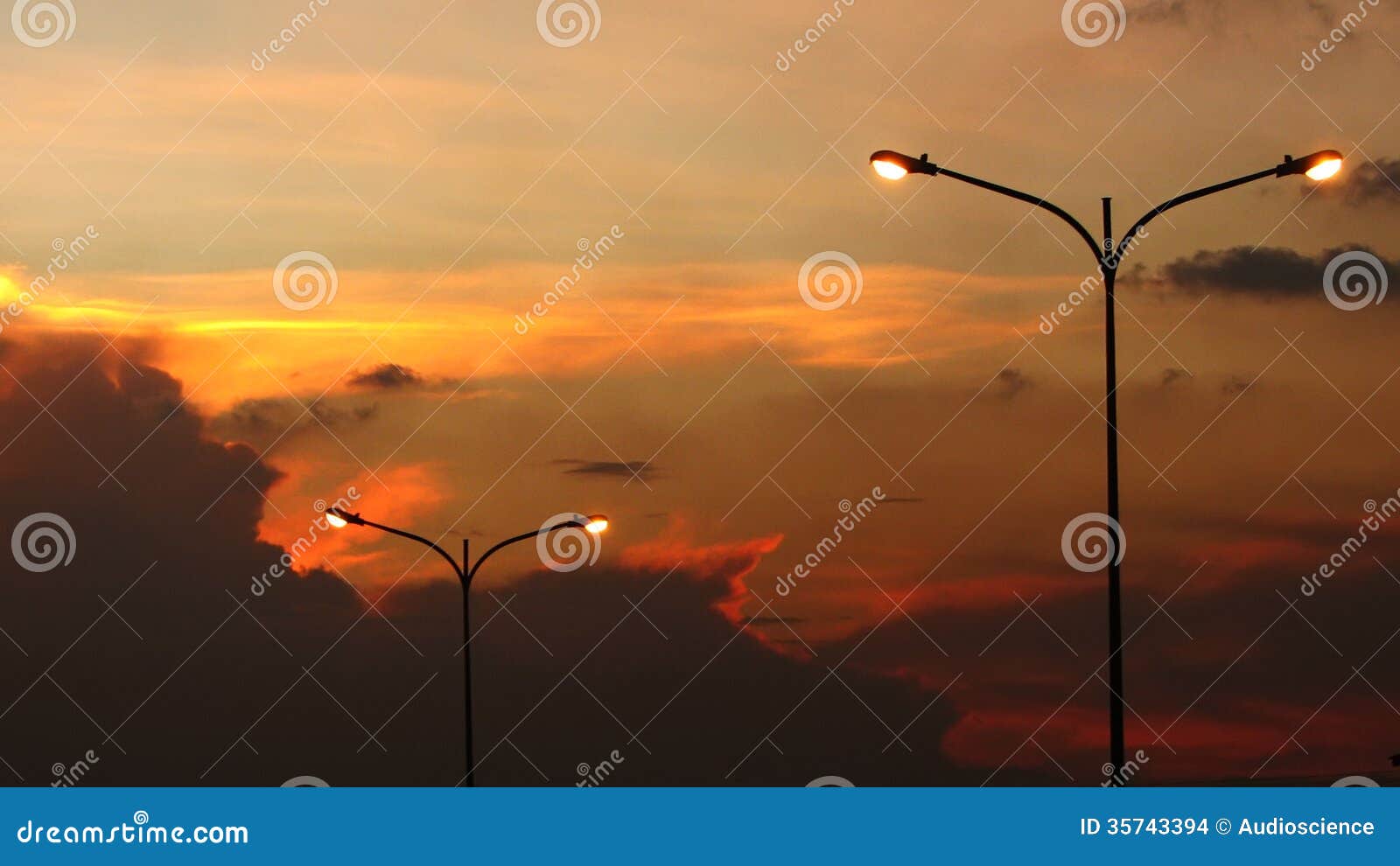Lamp Posts on Sunset Twilight Stock Photo - Image of horizon, colorful ...
