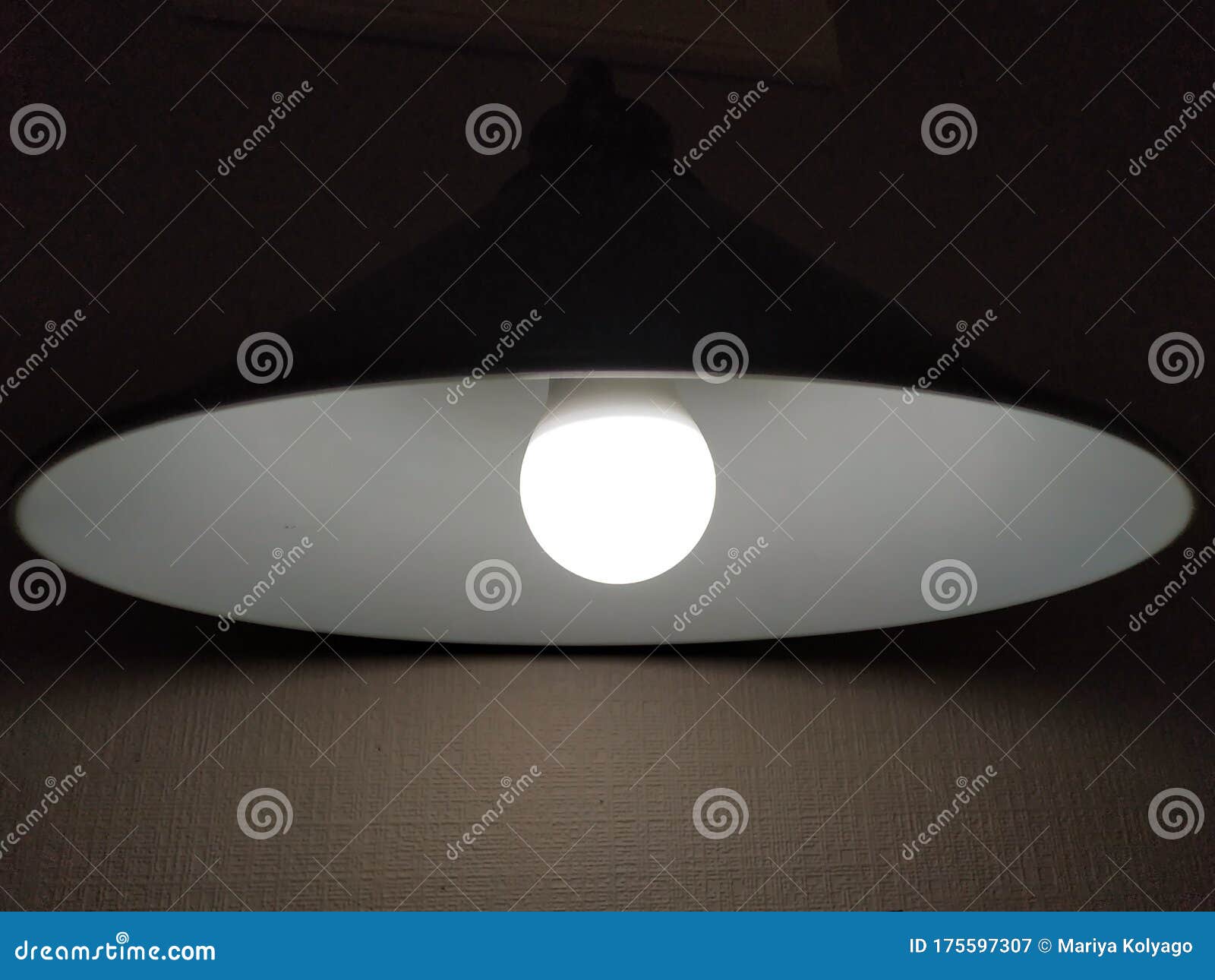 A Lamp with a Round Shade Shines in the Dark Stock Image - Image of ...