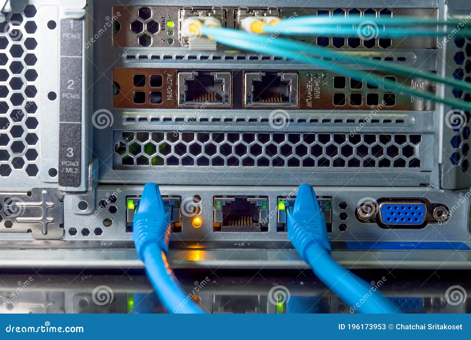 Lan and Fiber Optic Cables are Plugged into the Back Panal of the ...
