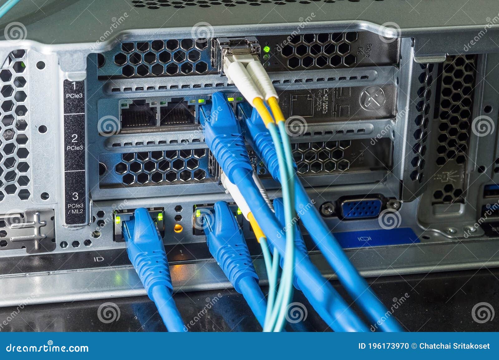 Lan and Fiber Optic Cables are Plugged into the Back Panal of the ...