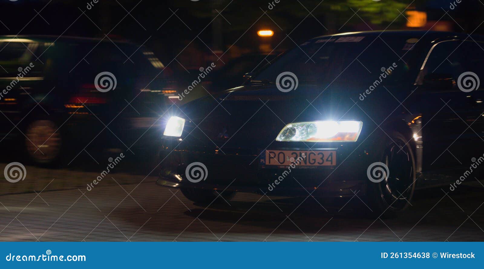 Lancer Evolution VIII Wagon in the Dark with Headlights on Editorial ...