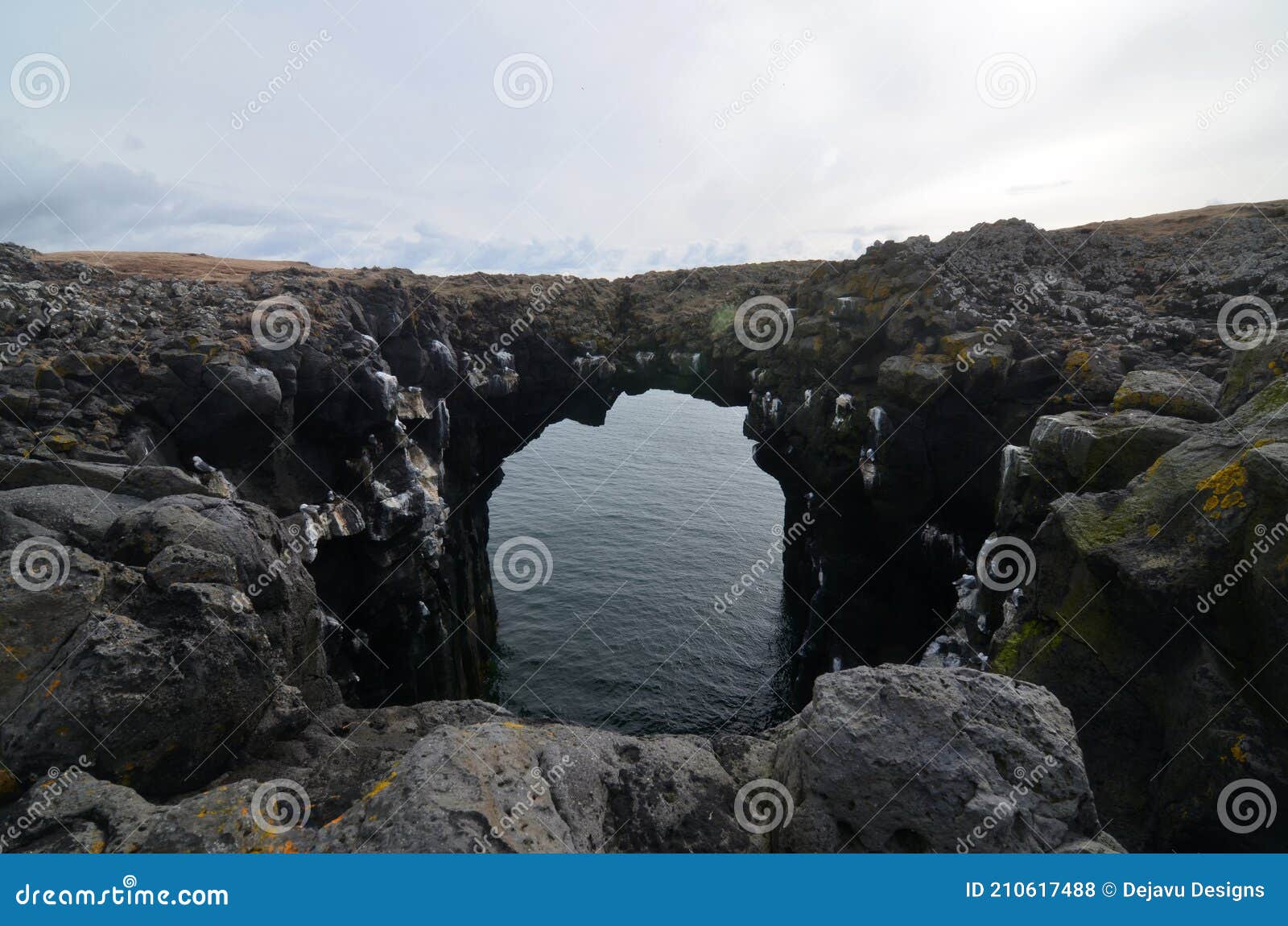 Land Bridge Made of Rock Along the Coast of Iceland Stock Photo - Image ...