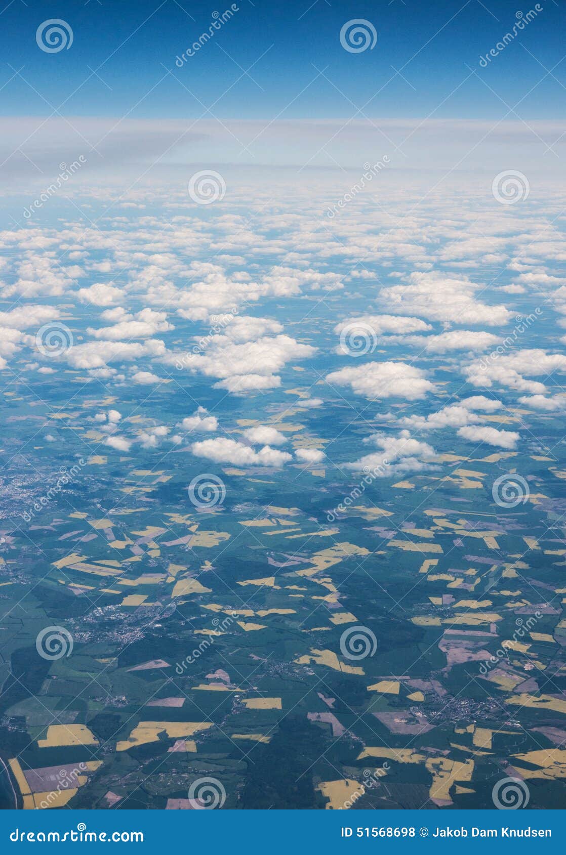 Land Mass Seen from Above, through the Clouds Stock Photo - Image of ...
