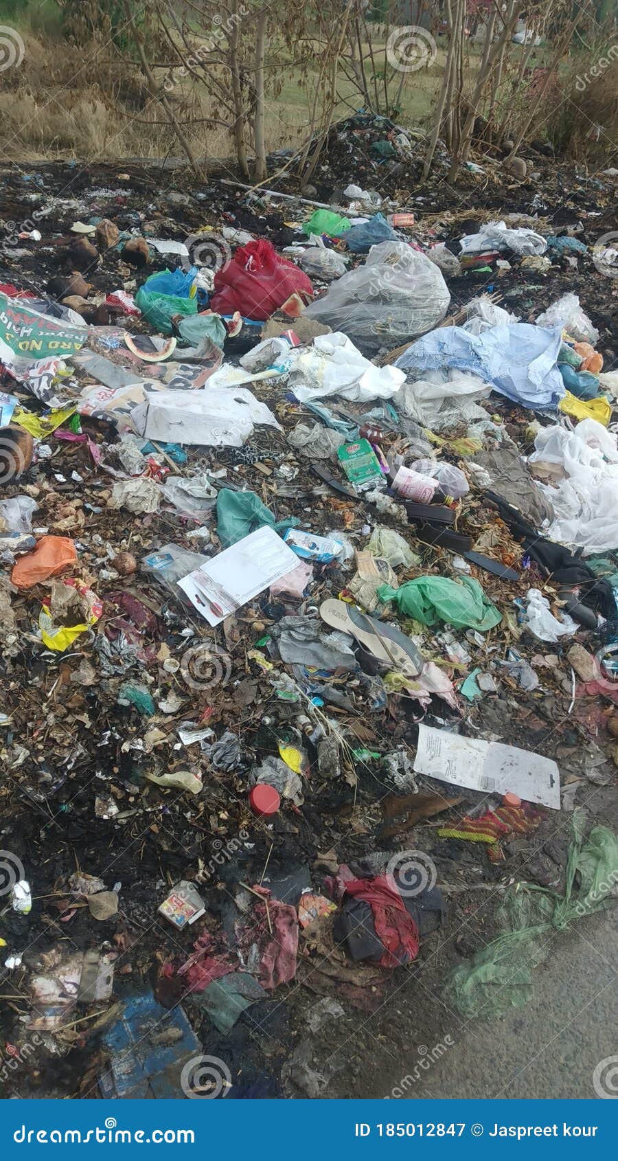 Land Pollution With Plastic Bottles And Bags. Open Storage Of Solid ...