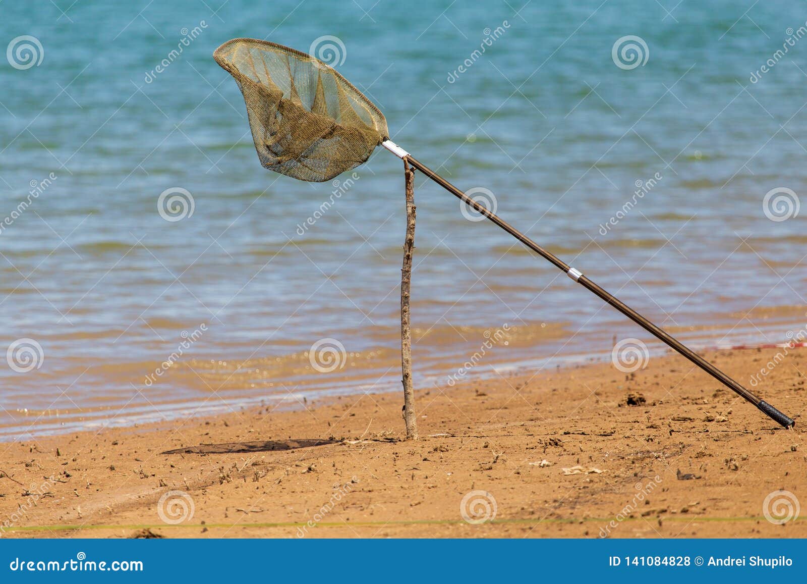 Landing Net for Fishing on the Shore Stock Photo - Image of river ...