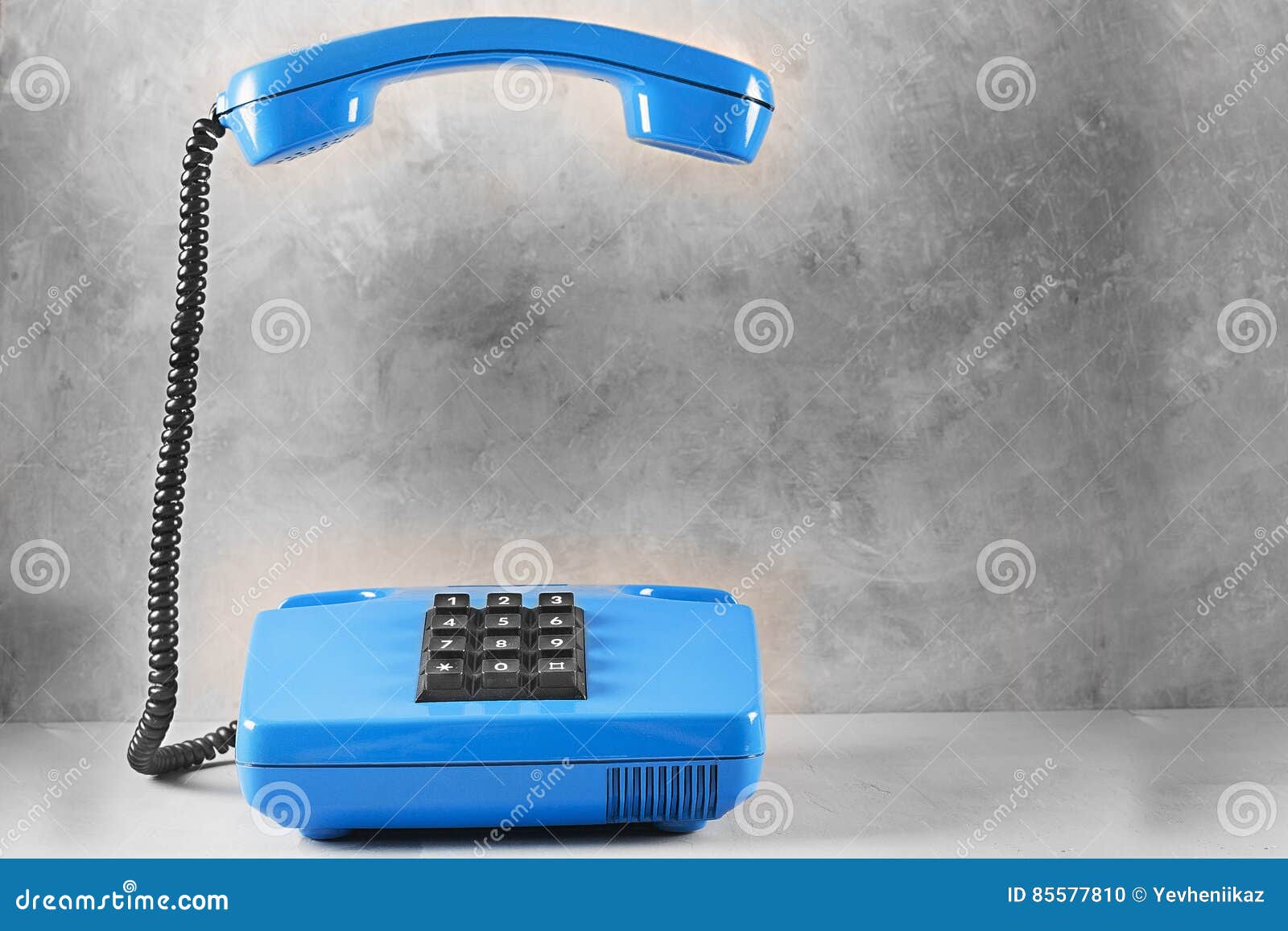 Landline Blue Phone on Gray Wall Background Stock Photo - Image of ...