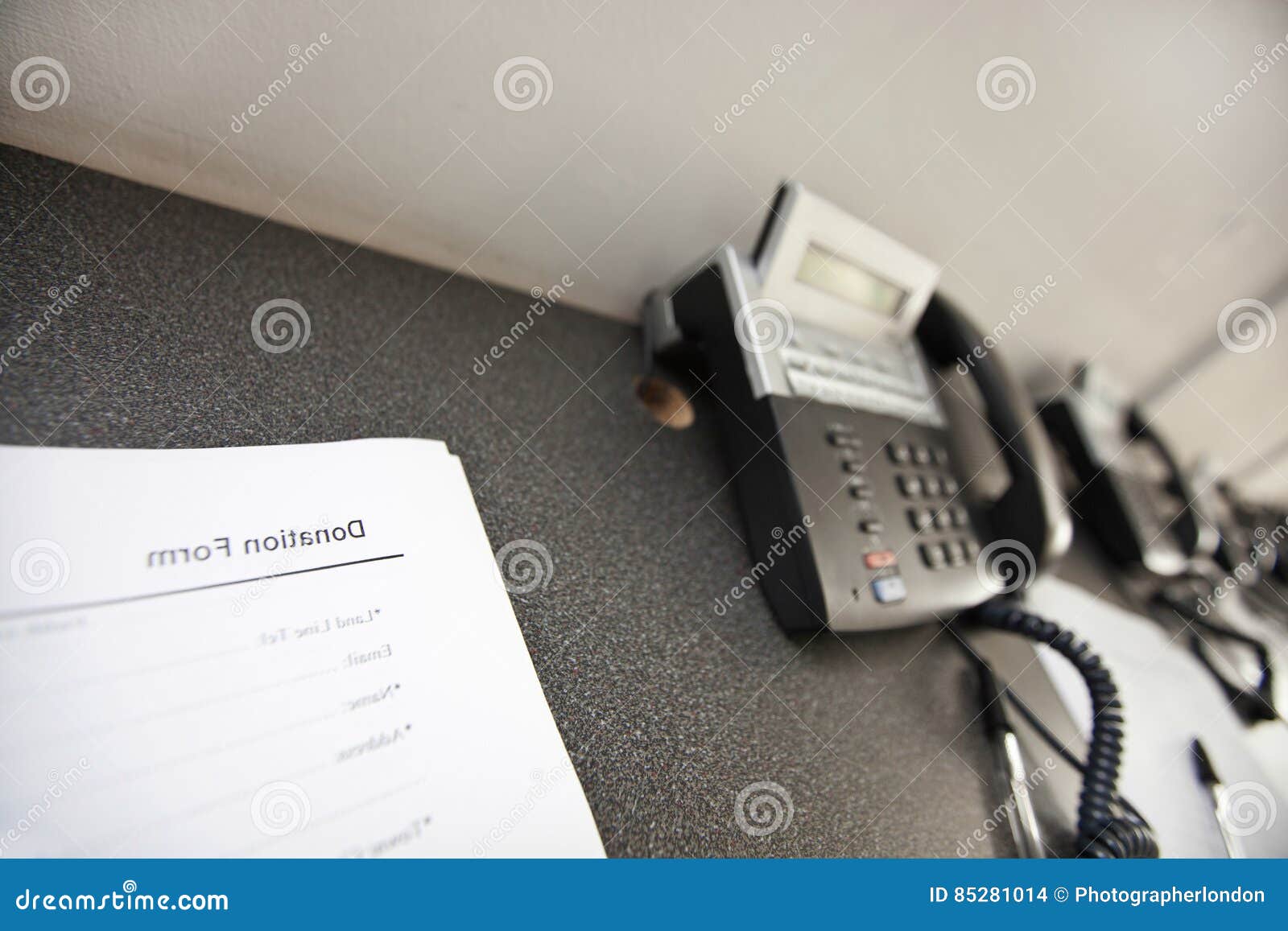 Landline Telephones and Document on Table in Office Stock Photo - Image ...