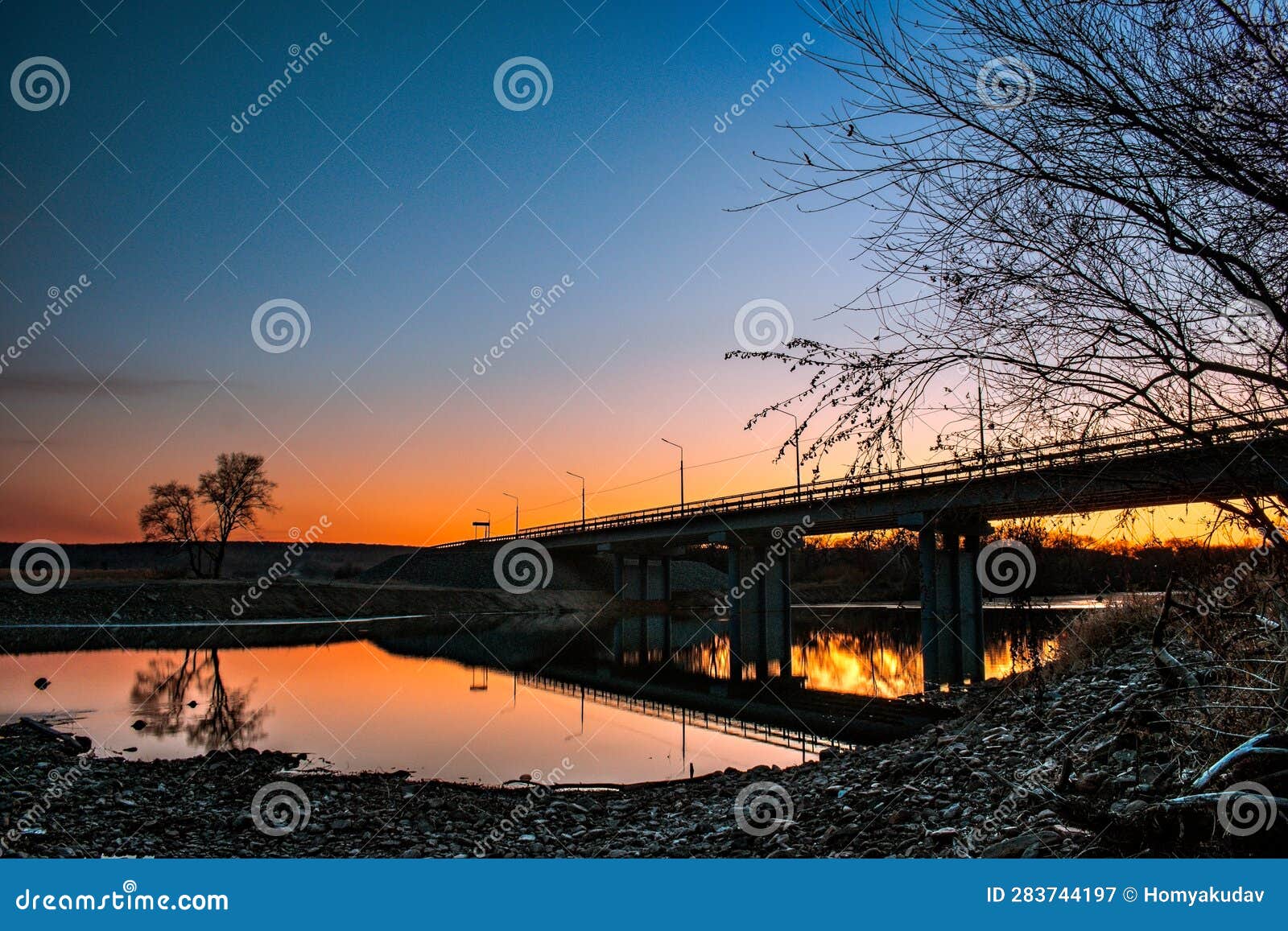 Landscape Bridge Over a River with a Mirror-smooth Surface during ...
