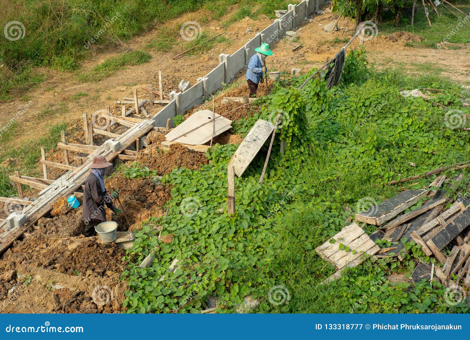 Landscape of Construction Site with Workers Digging the Soil Ground for ...