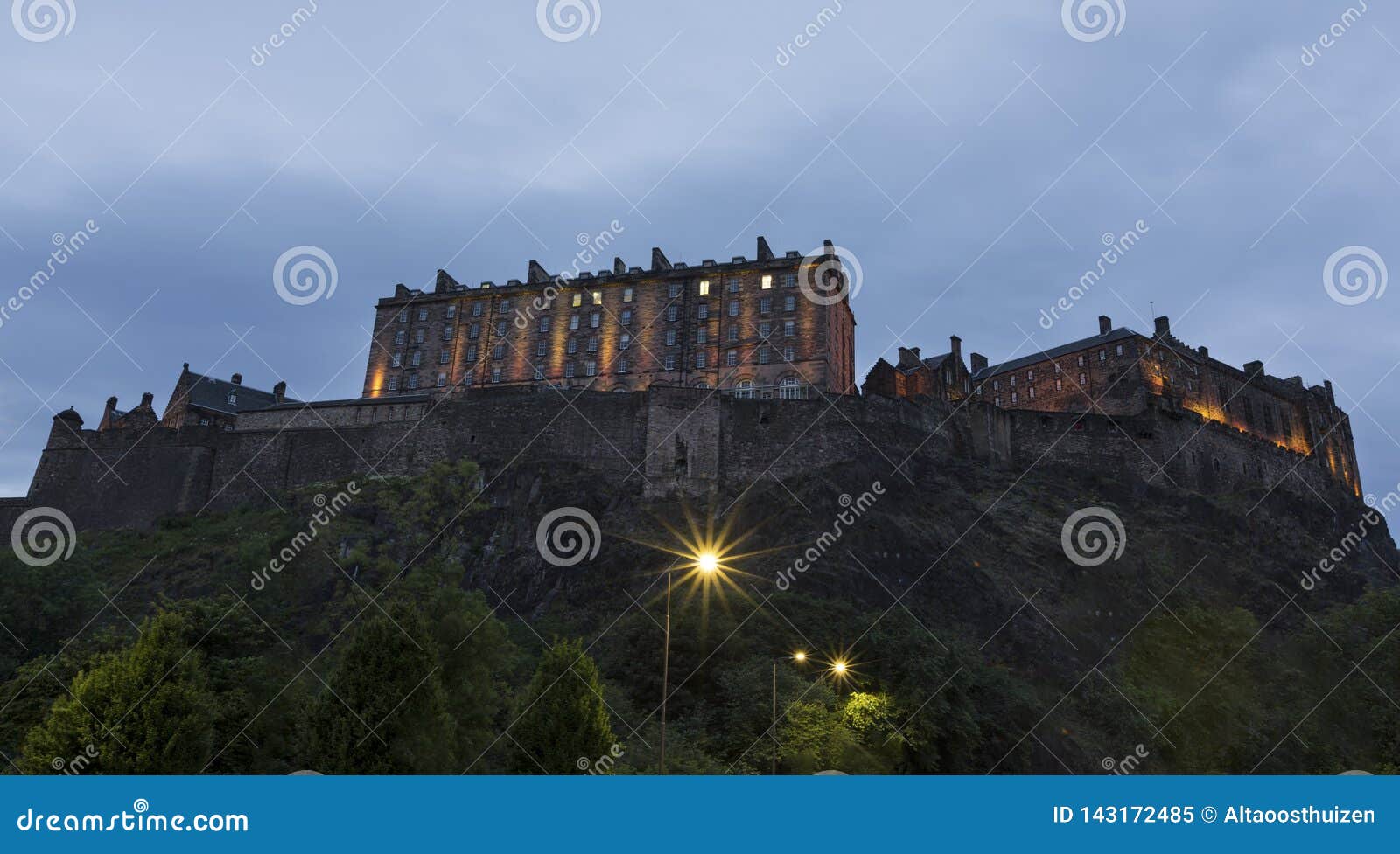 Landscape of the Edinburgh Castle on a Cloudy Evening with Lights Stock ...