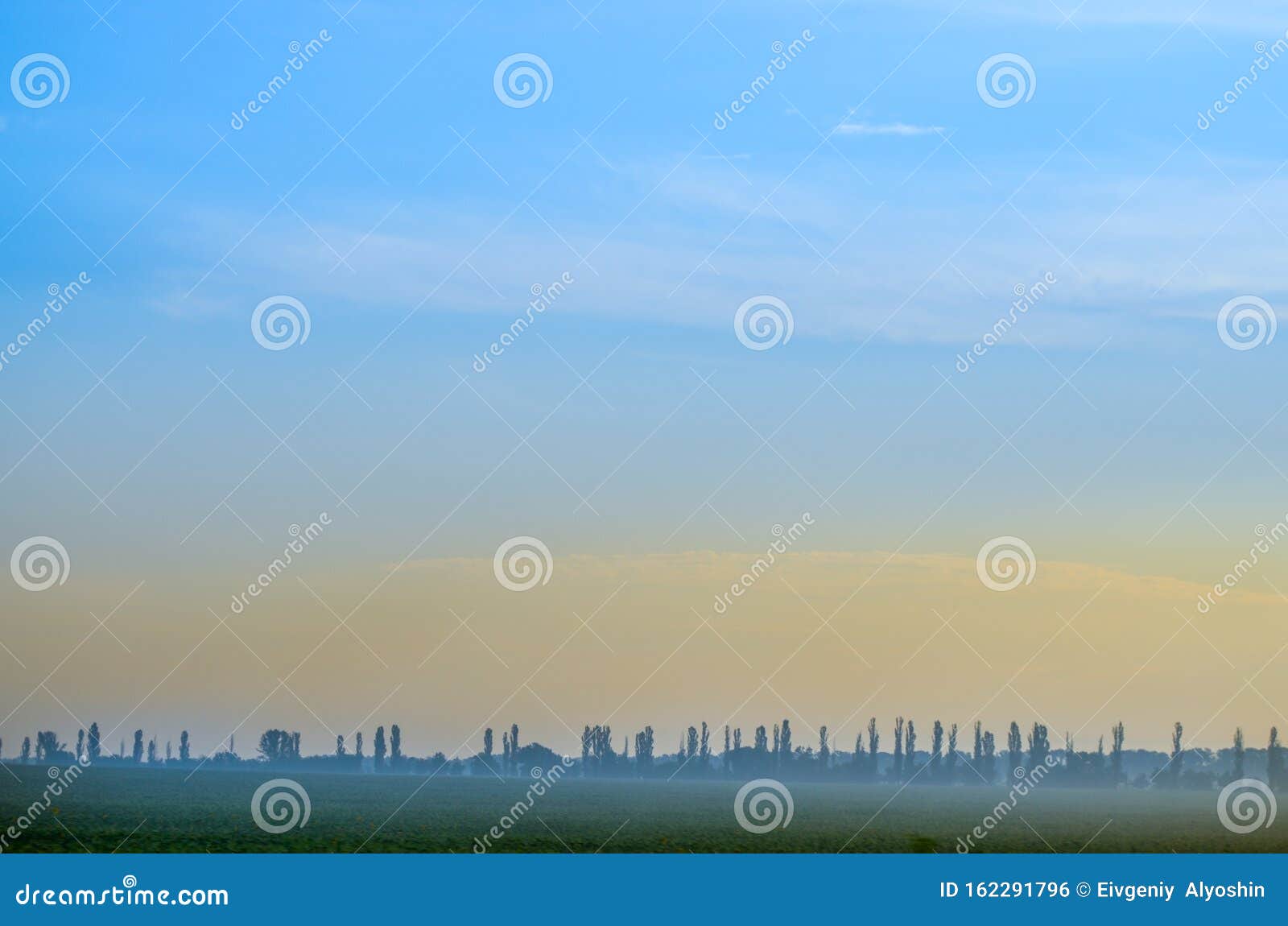 Landscape with Far Away Tree and Blue Clouds Stock Photo - Image of ...