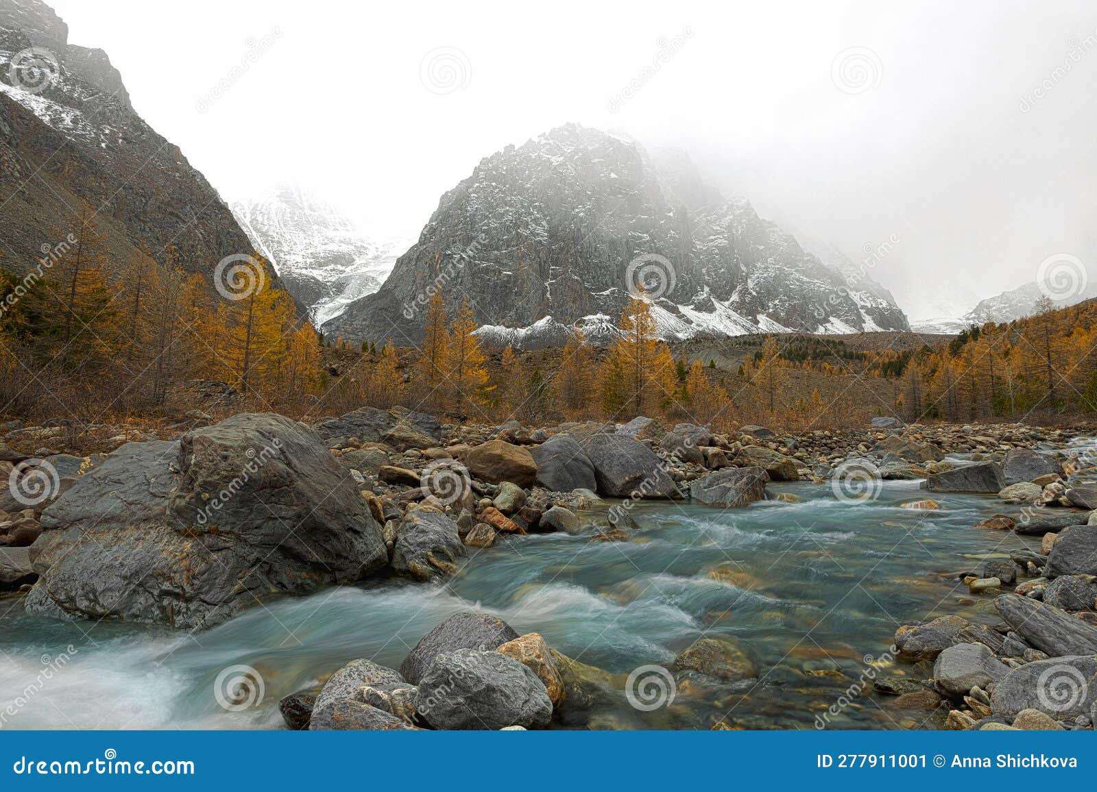 A Landscape of a Fast-flowing Blue Mountain River with Blurred White ...