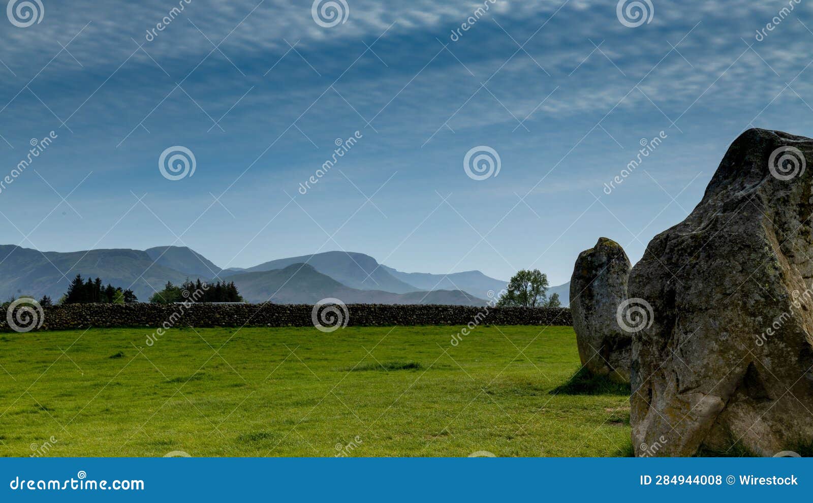 Landscape Featuring Large Rocks in a Grassy Field Stock Photo - Image ...
