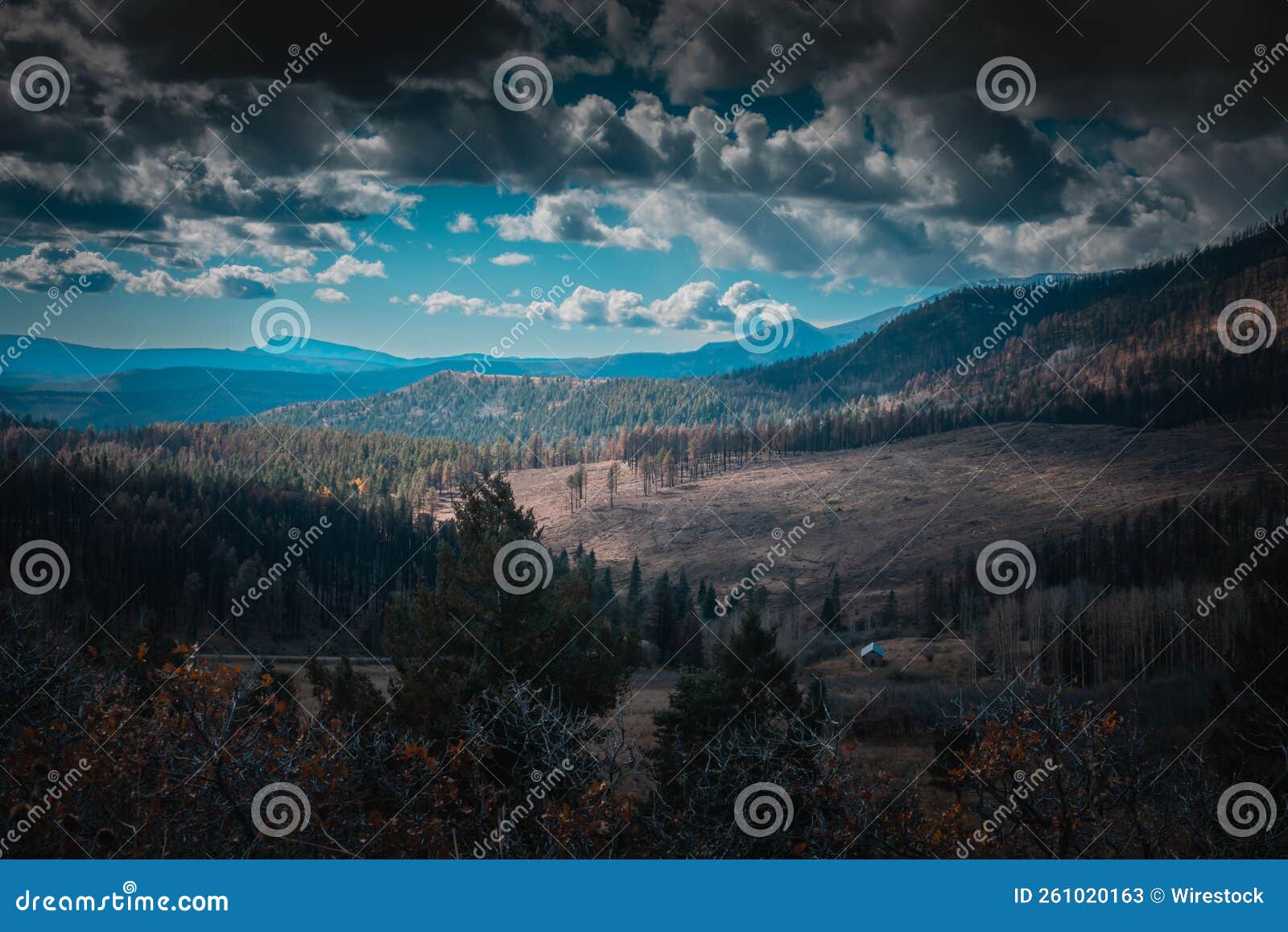 Landscape with Mountains Covered in Forests with a Beautiful Cloudy Sky ...
