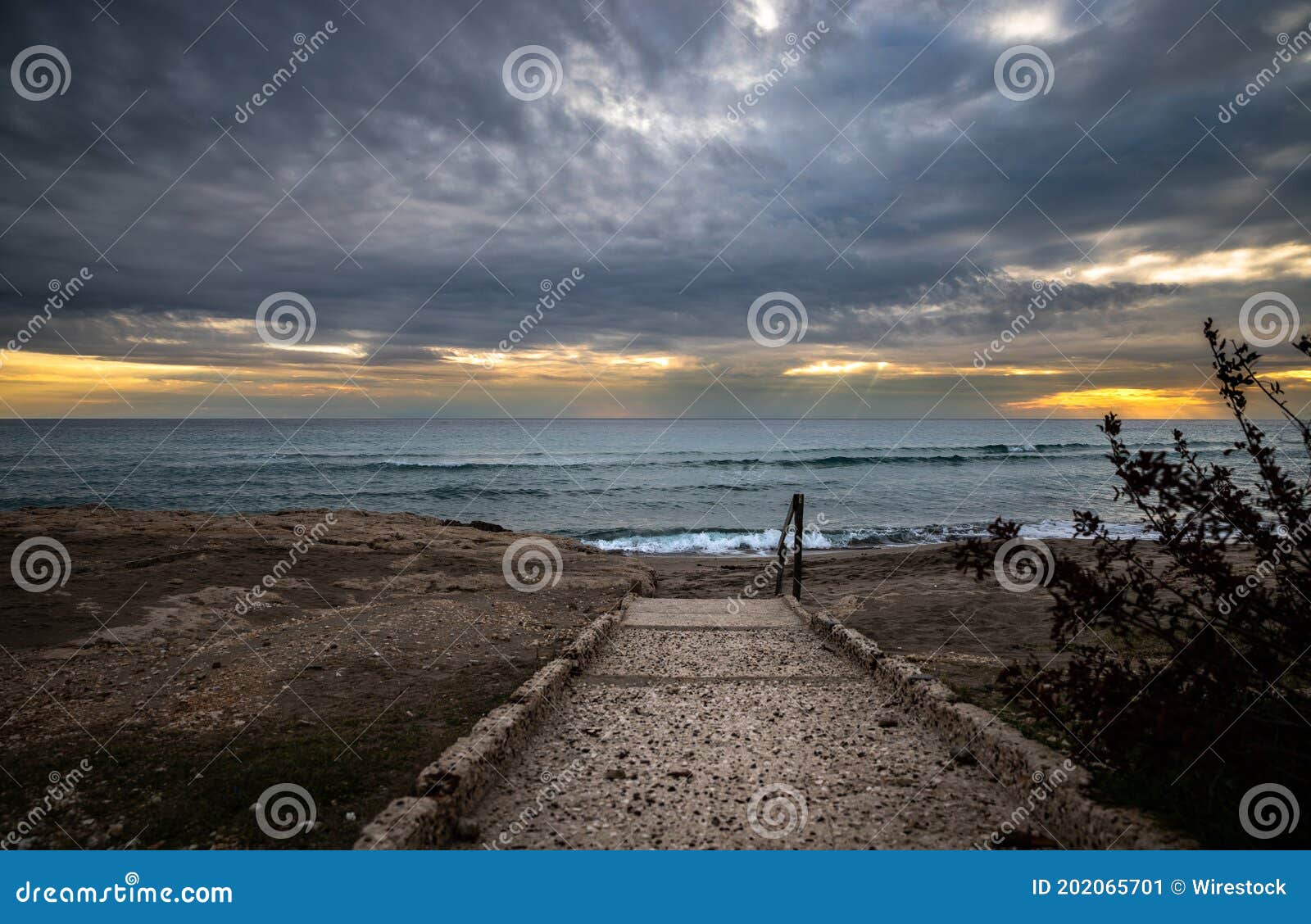 Landscape of Pathway into the Sea with Waves Tossing in the Sand during ...