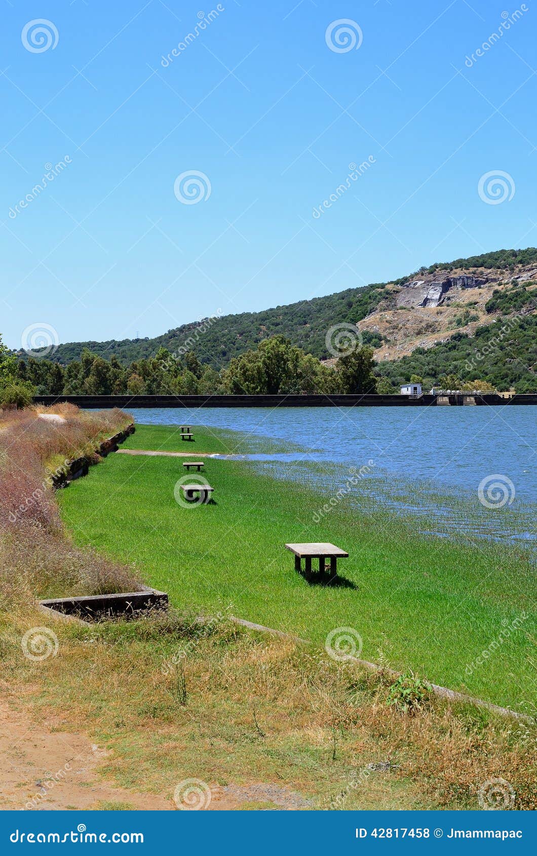Landscape with Picnic Tables-vertical Stock Photo - Image of water ...