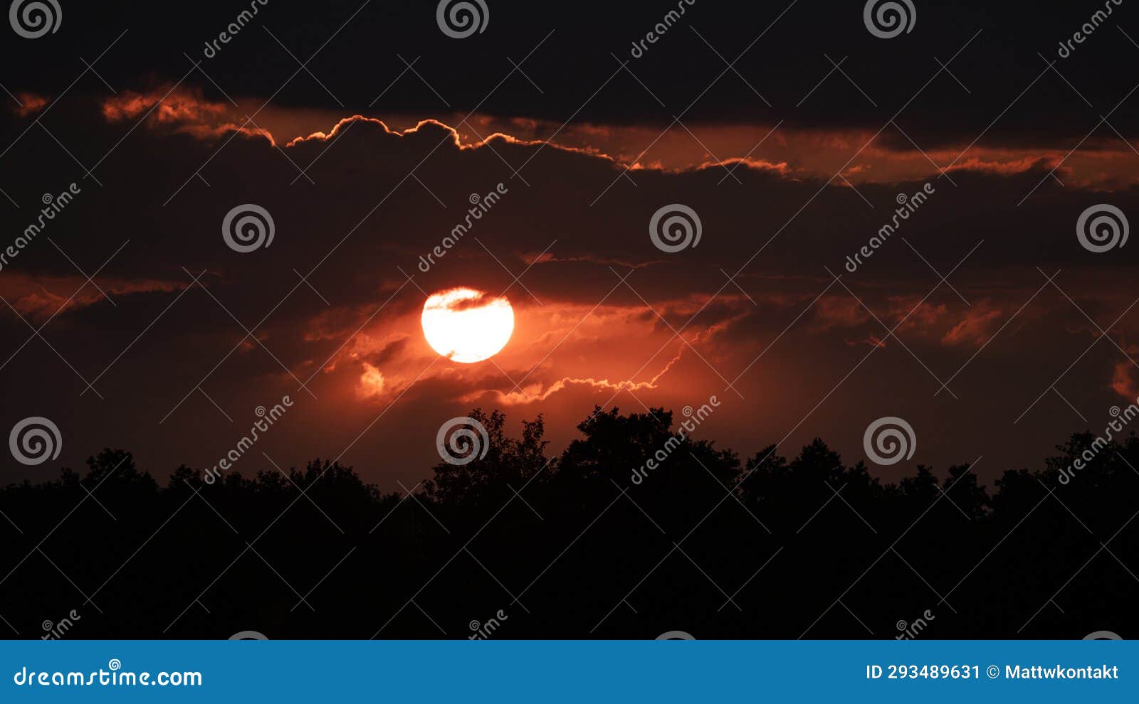 Landscape with Red Sun Setting Behind Dark Clouds Stock Image - Image ...