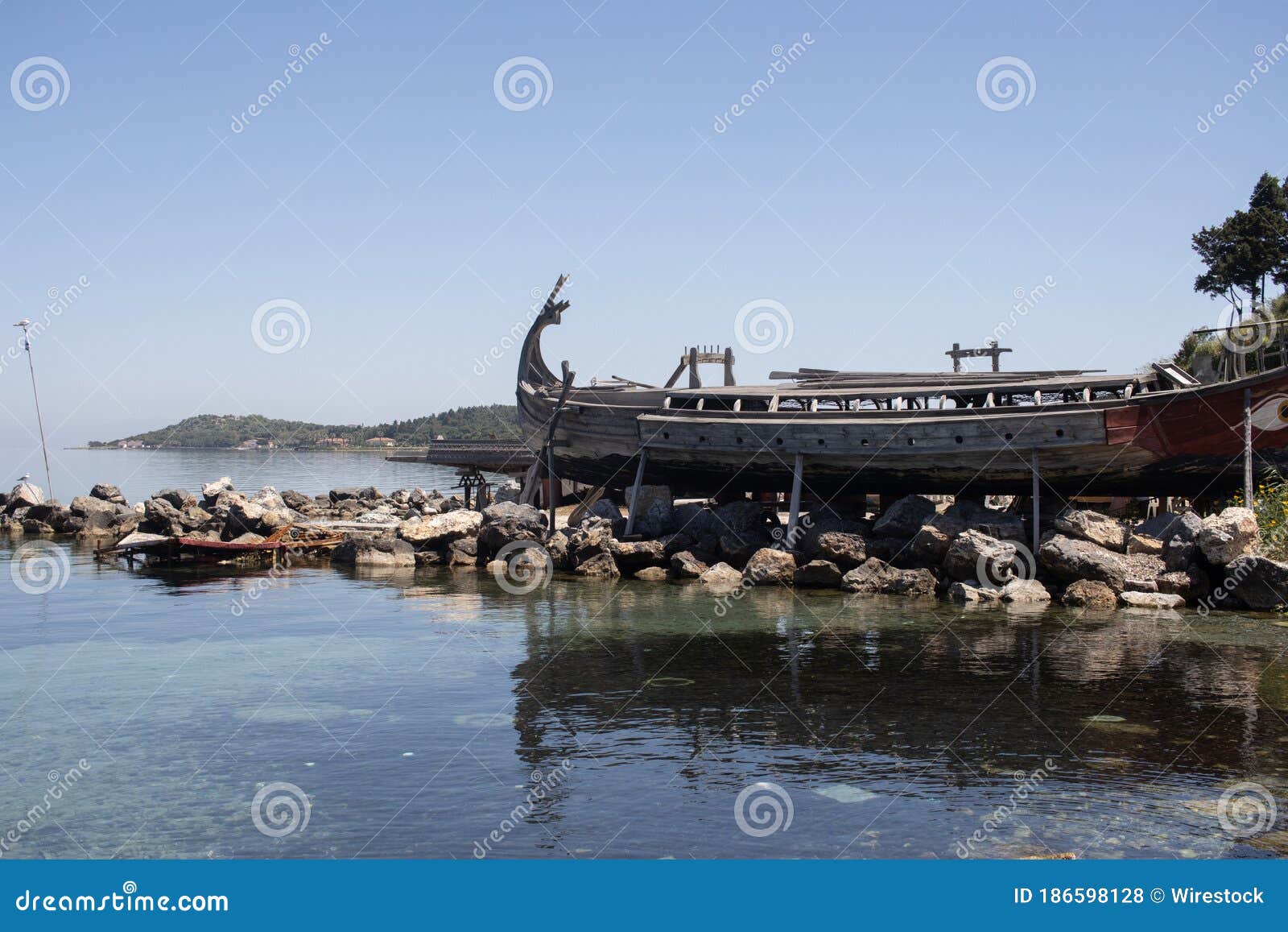 Landscape Shot of a Boat on Rocks Stock Photo - Image of sand, river ...