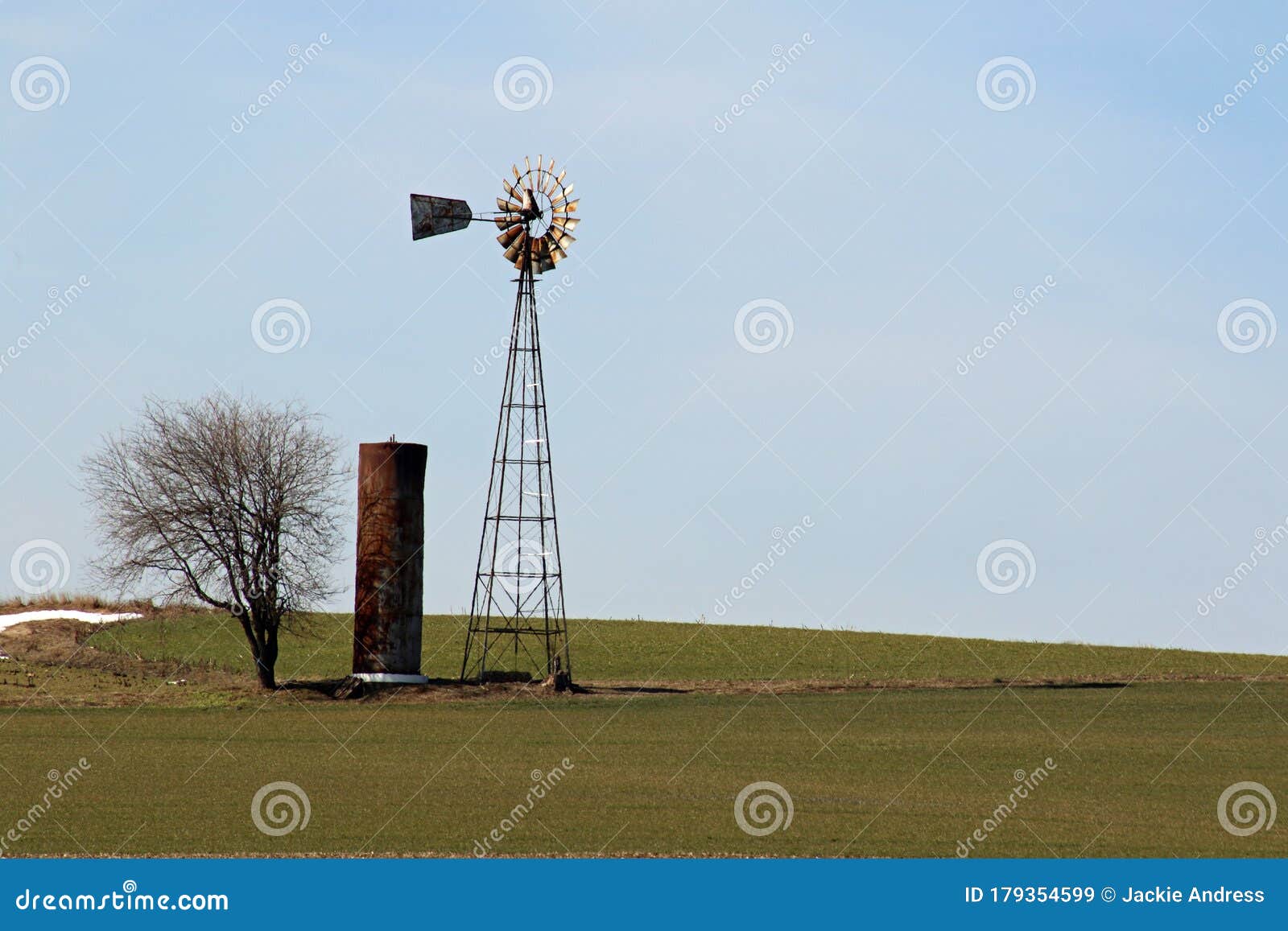Windmill, Cistern and Tree in Spring Field Stock Image - Image of early ...