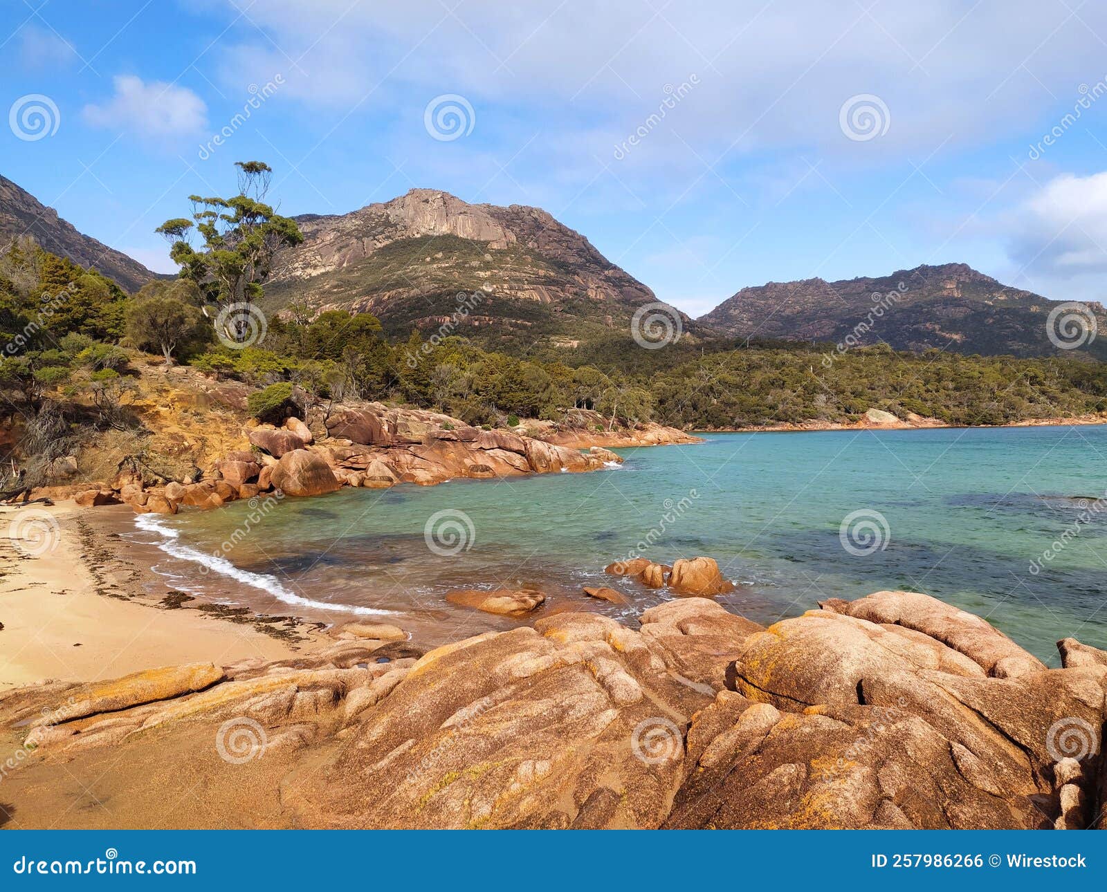 Landscape View of a Beach Surrounded by Rocks Stock Photo - Image of ...