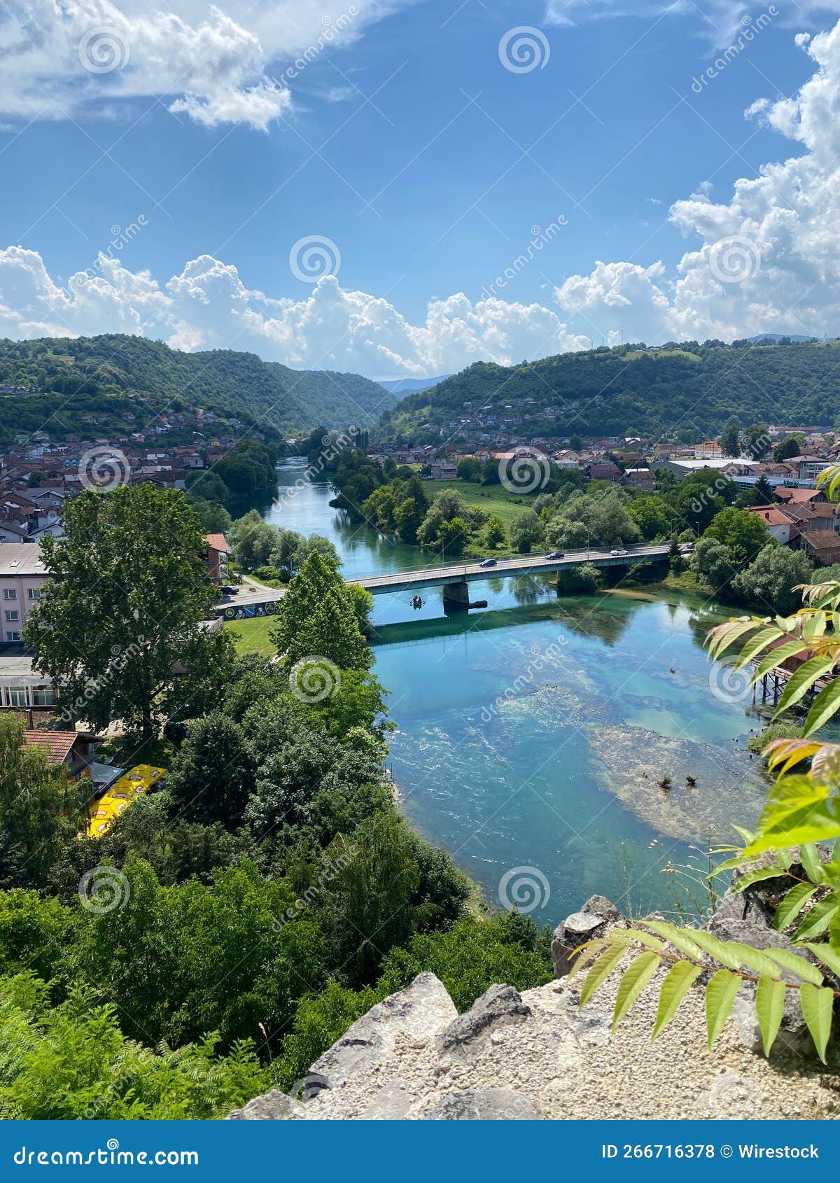 Landscape View of the Bridge Over the Narrow River between the Lush ...