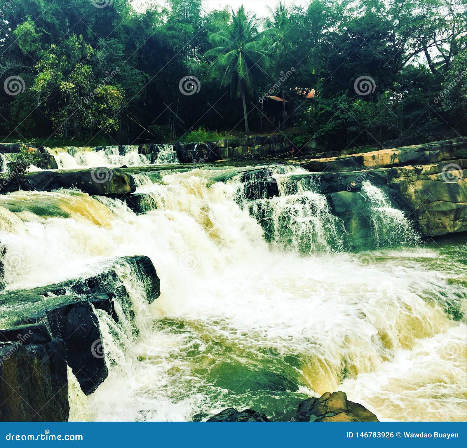 Landscape Waterfall .Large Rocks Split the Water on a River Flowing ...