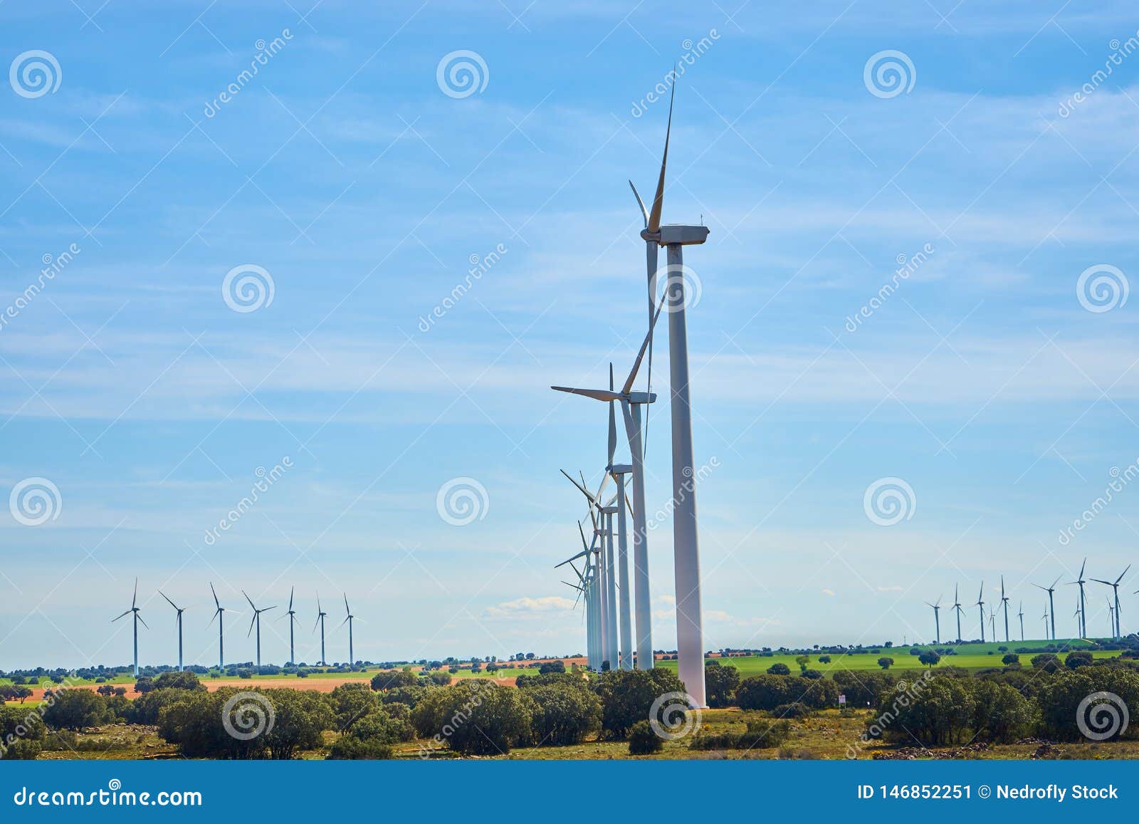 Landscape of Windmills in Spring with Fields Full of Brown and Green ...