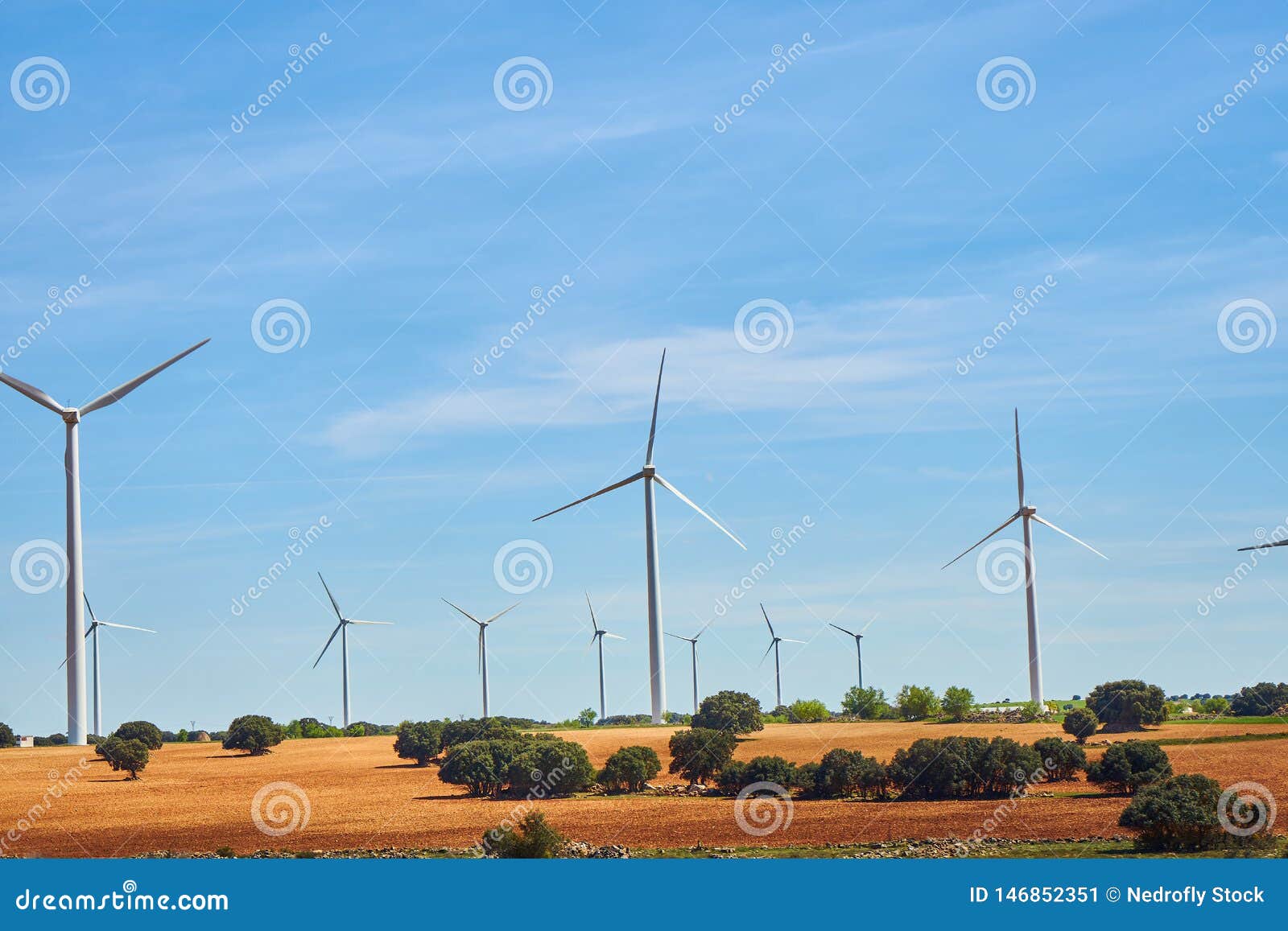 Landscape of Windmills in Spring with Fields Full of Brown and Green ...