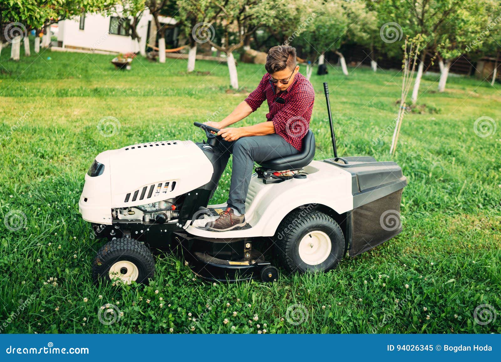 Landscaping Details - Man Using Professional Tractor For Cutting And ...