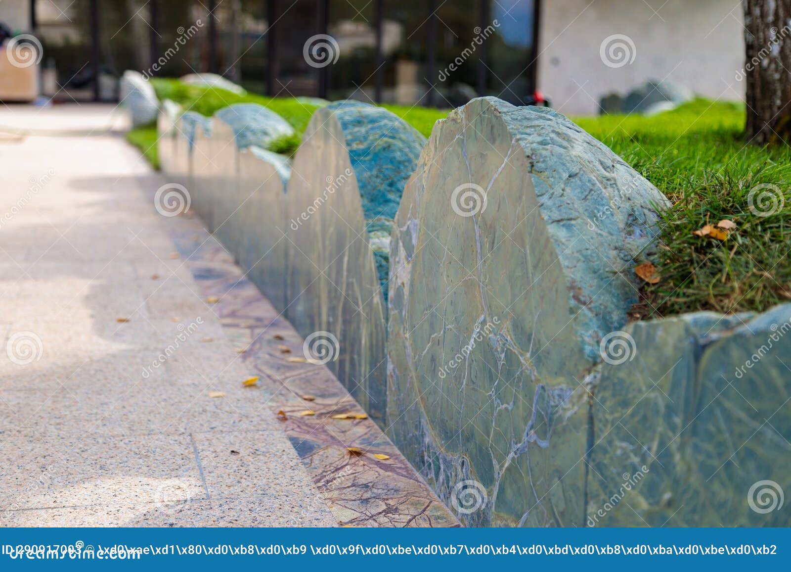 Landscaping, Edging the Path with Boulders of Diabase Stone. Stock ...