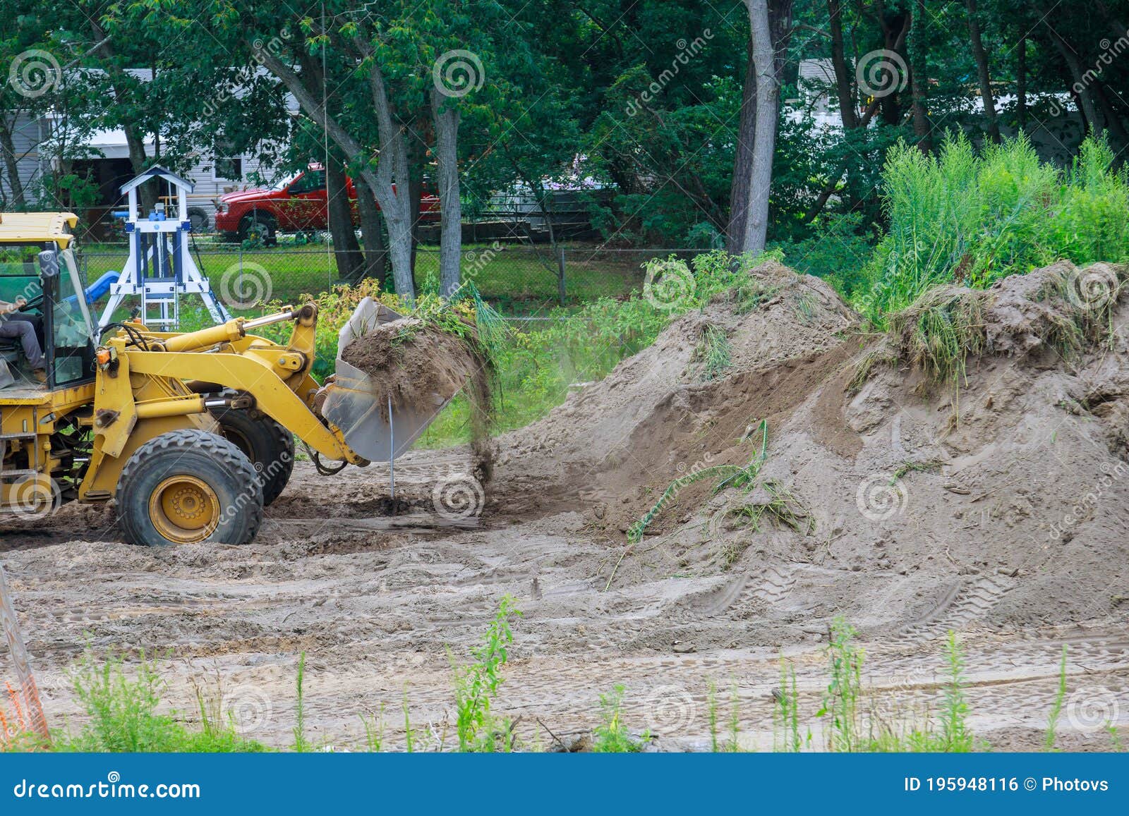 Landscaping Works on the Bulldozer Moves Soil Digging Ground ...
