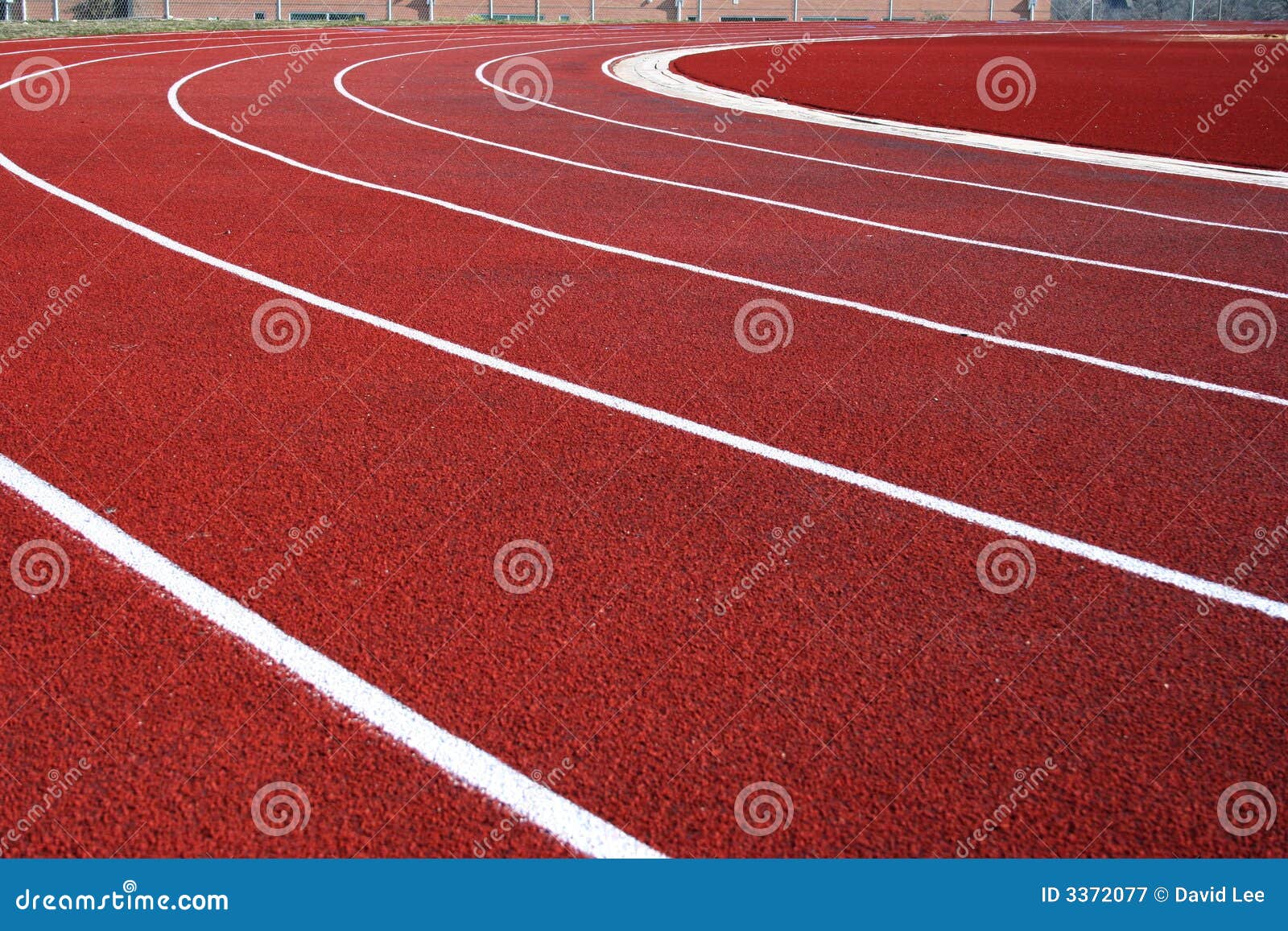Lanes on red running track stock image. Image of field - 3372077