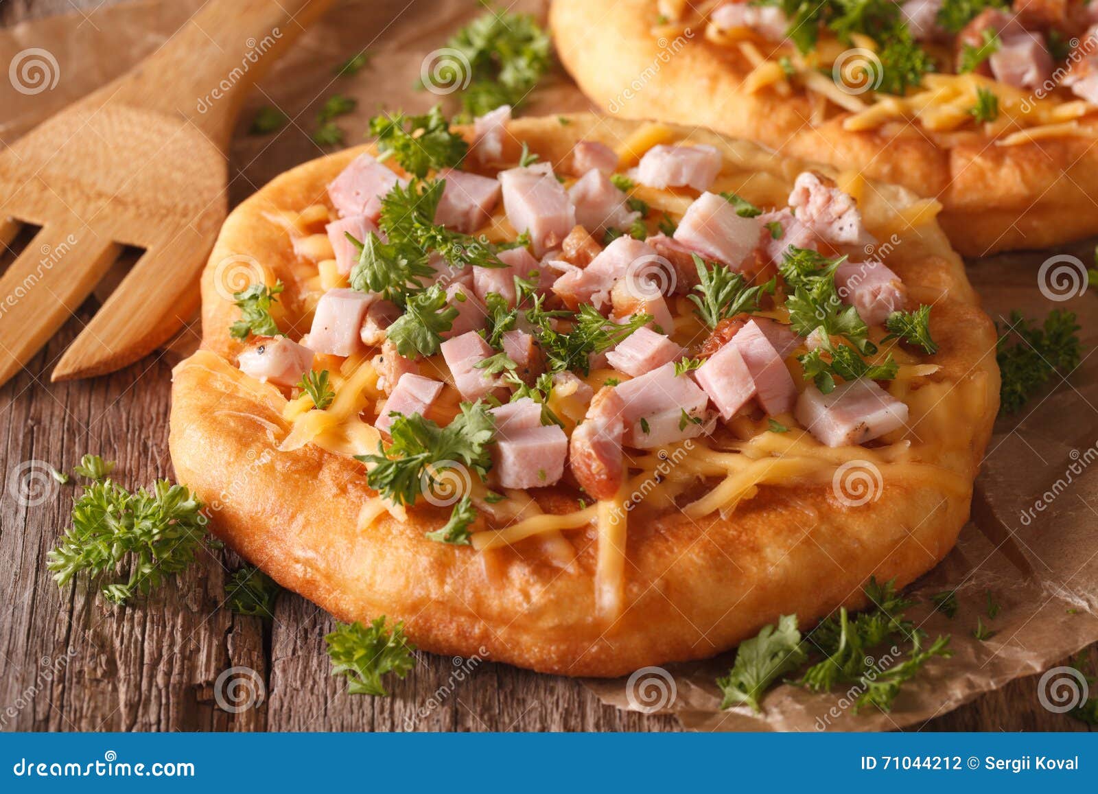 Langos Deep Fried with Cheese and Ham Close-up. Horizontal Stock Photo ...