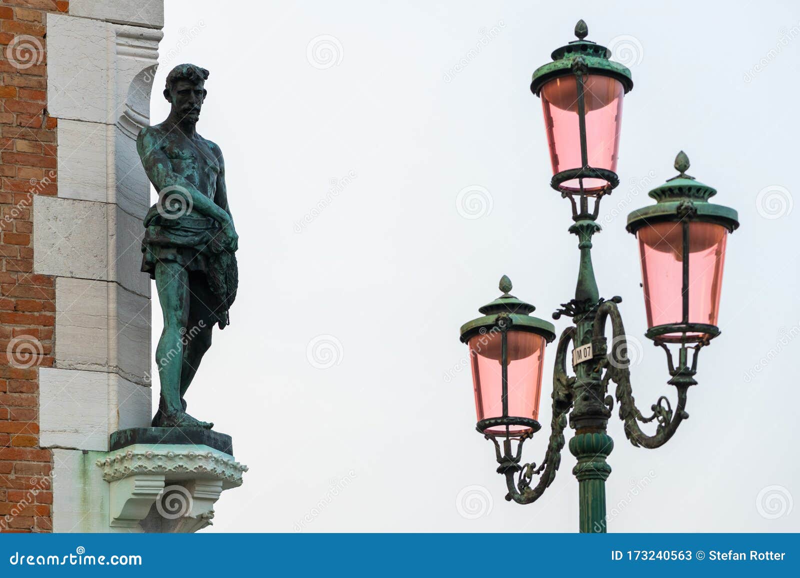 Lantern and Bronze Statue of a Man in Venice Stock Image - Image of ...