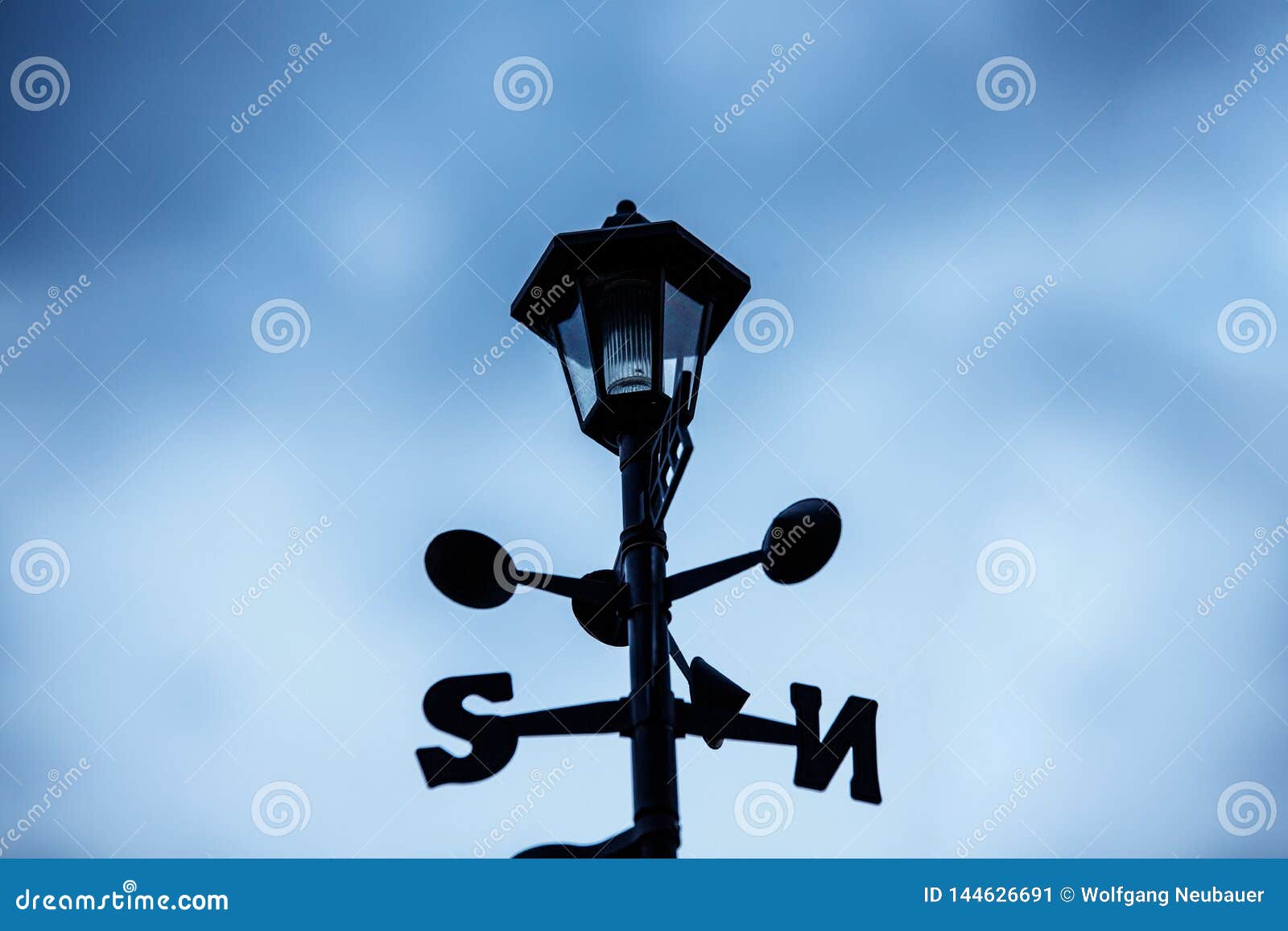 Lantern with Cardinal Direction at Dusk Measuring Wind Speed Stock ...