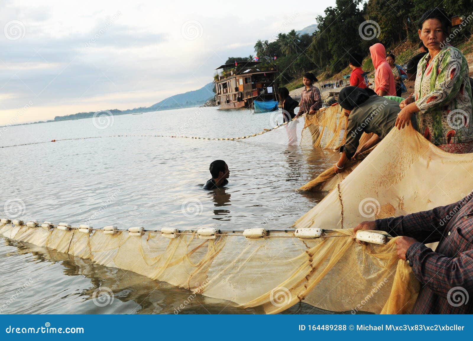 Lao Fishermen Taking in the Net from Mekong River Editorial Stock Photo ...