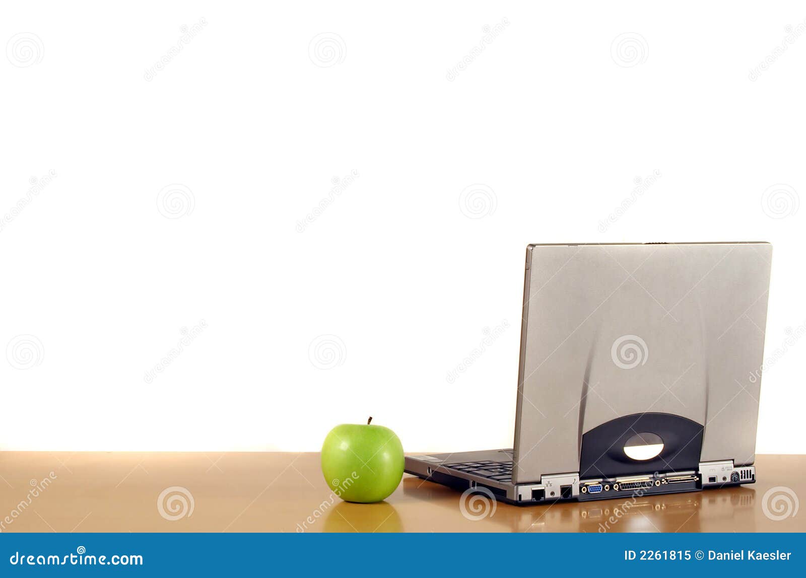 Laptop And Apple On Desk Royalty Free Stock Photo - Image: 2261815