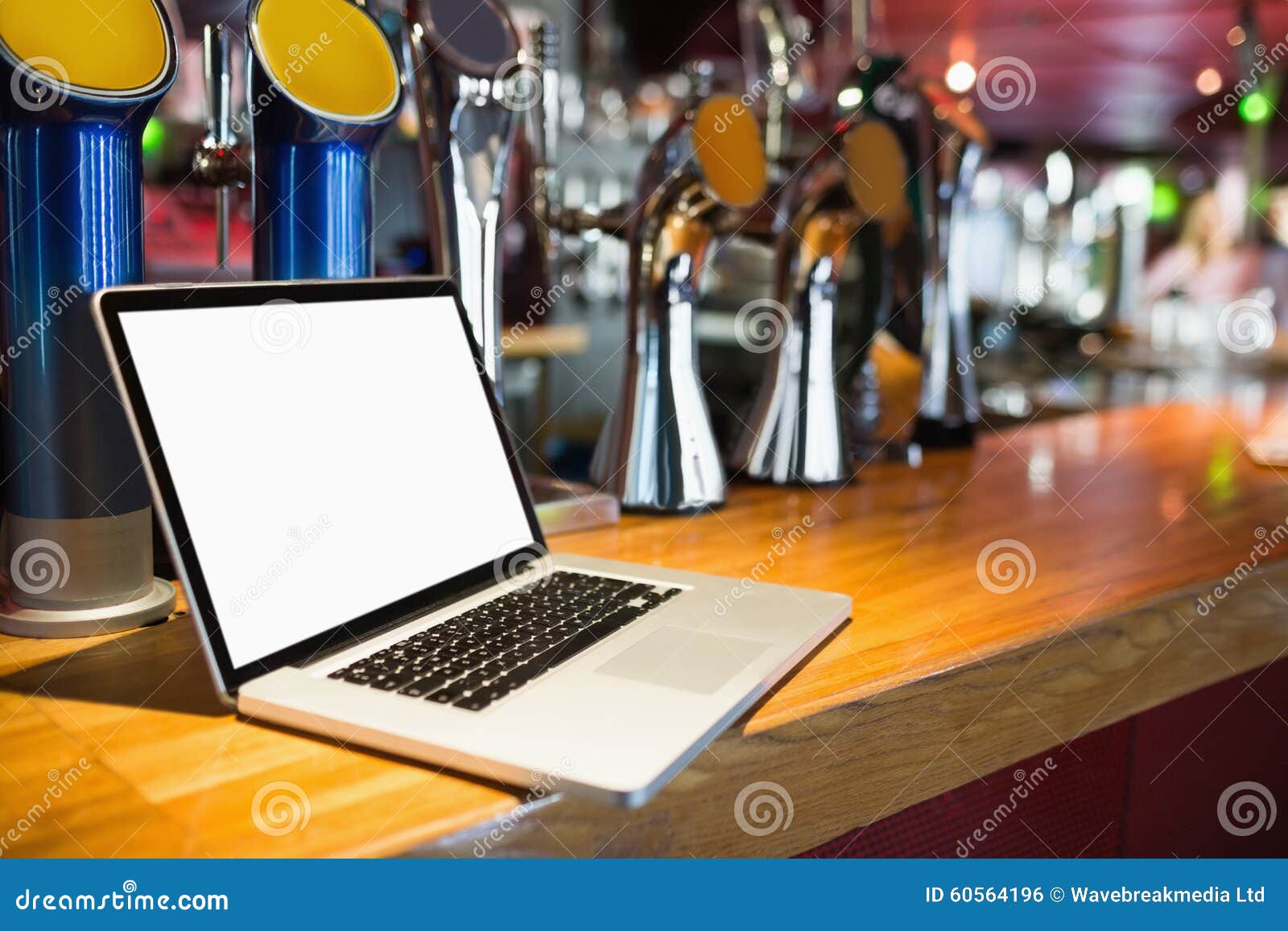 Laptop on bar counter stock photo. Image of table, metal - 60564196