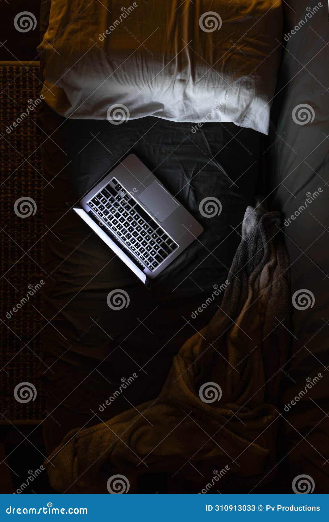 Laptop on the Bed at Night, Light from the Laptop Screen, Top View ...