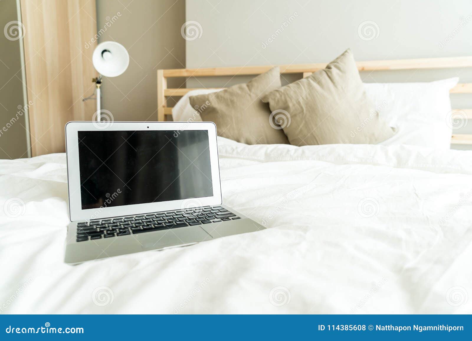 Laptop on bed stock photo. Image of modern, white, office - 114385608