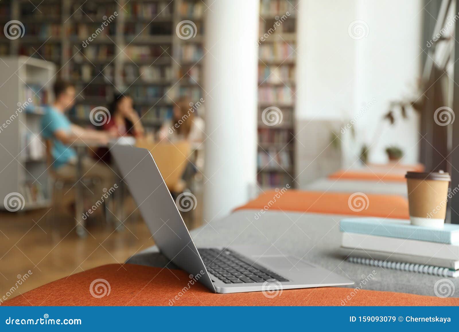 Laptop on bench in library stock image. Image of learning - 159093079