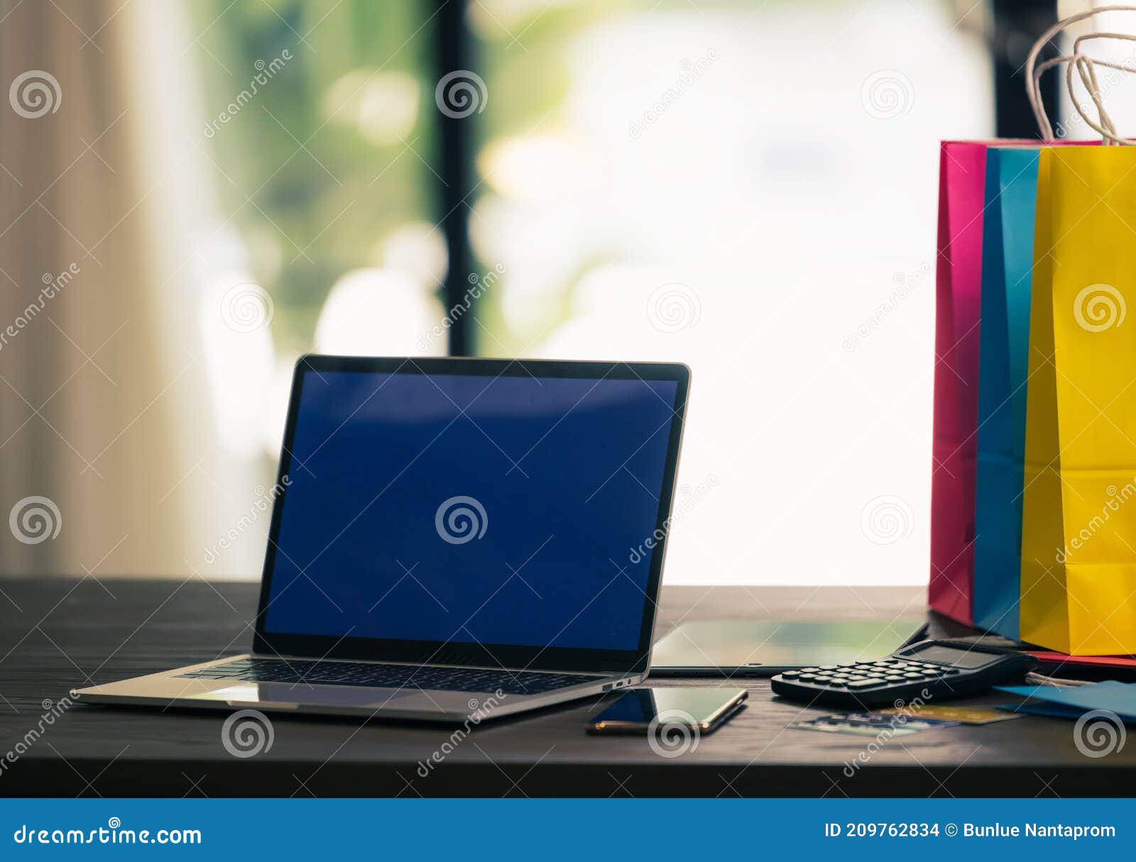 Laptop with Blank Blue Screen on Table Stock Photo - Image of library ...