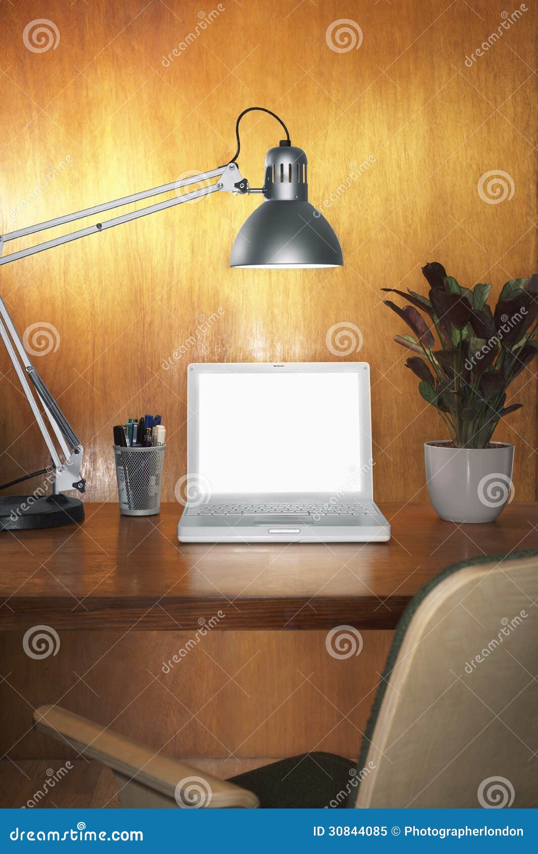 Laptop with Blank Screen and Other Items on Desk with Chair Editorial ...