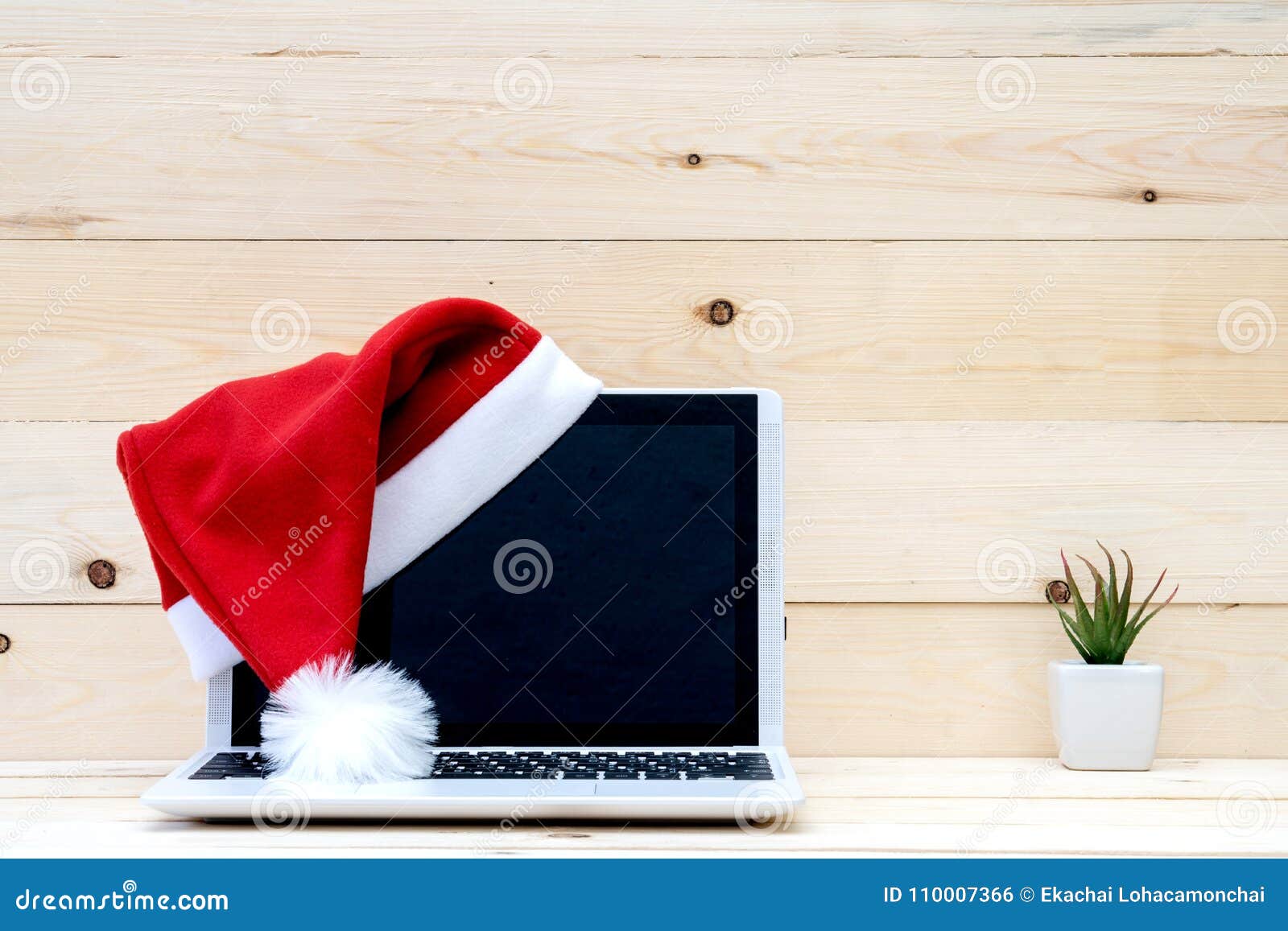 Laptop Santa Claus hat stock photo. Image of humor, season - 110007366